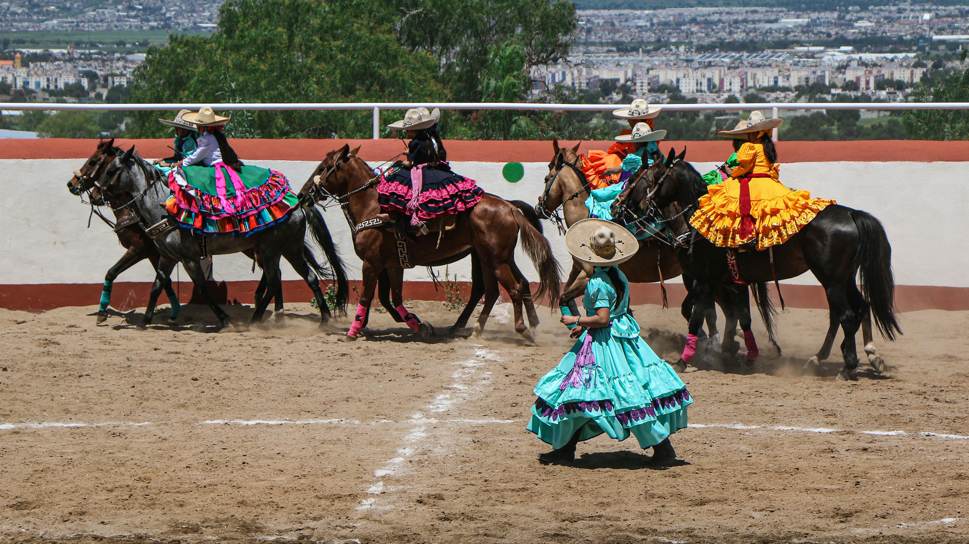 A group of women riding horses in a mexican rodeo · Free Stock Photo