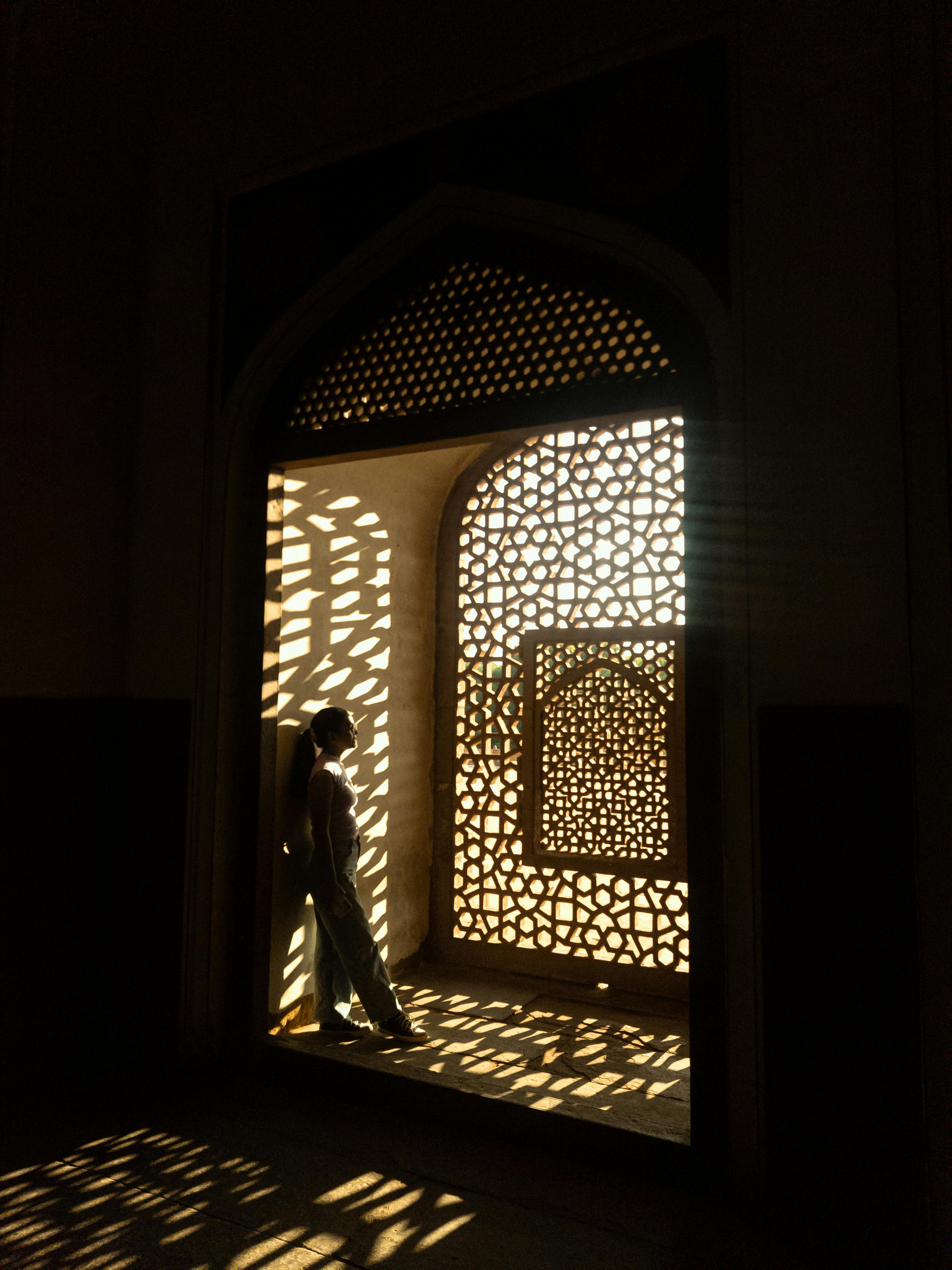 A man stands in the shadow of a window · Free Stock Photo