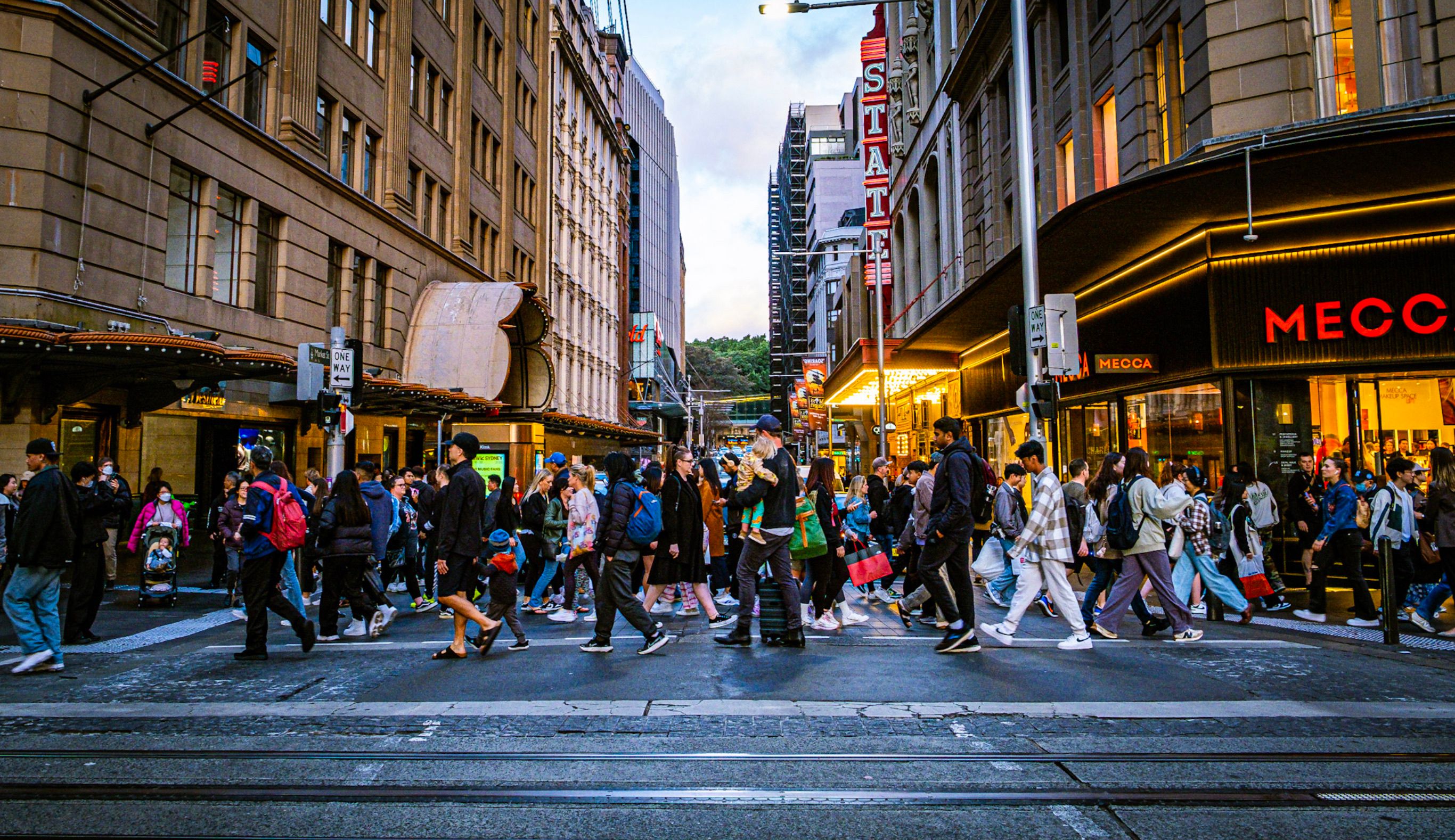 A group of people crossing a busy street in a city · Free Stock Photo