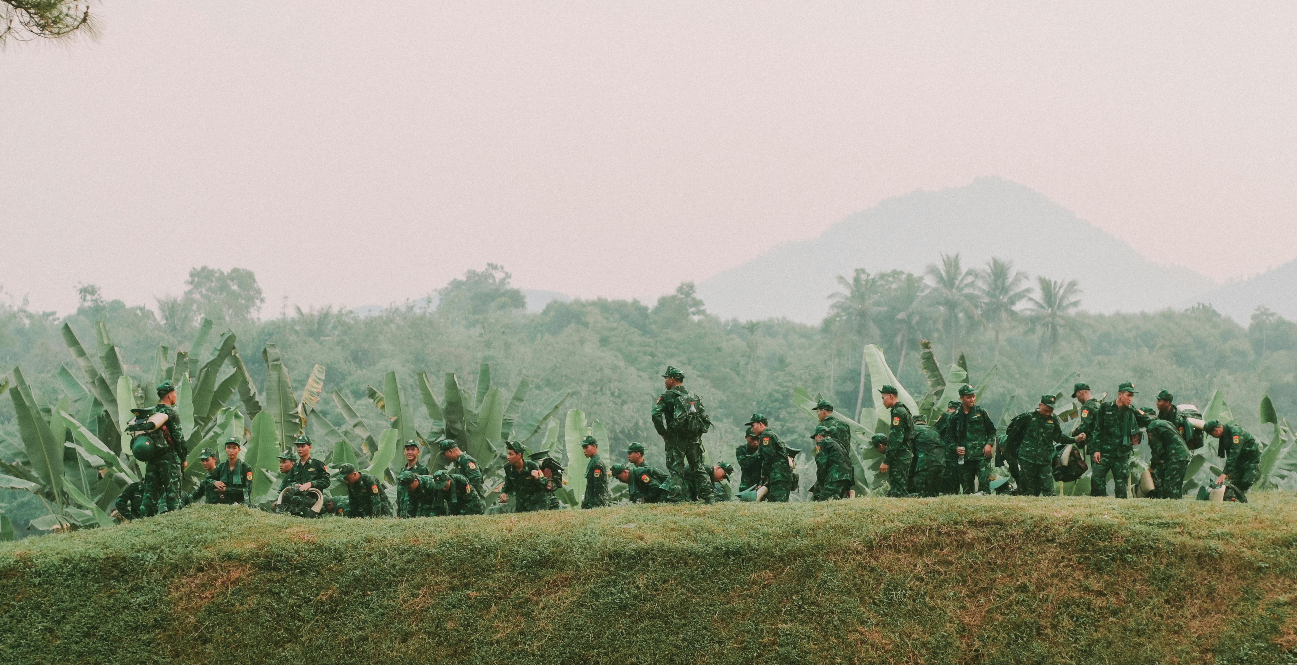 A group of soldiers standing on a hill · Free Stock Photo