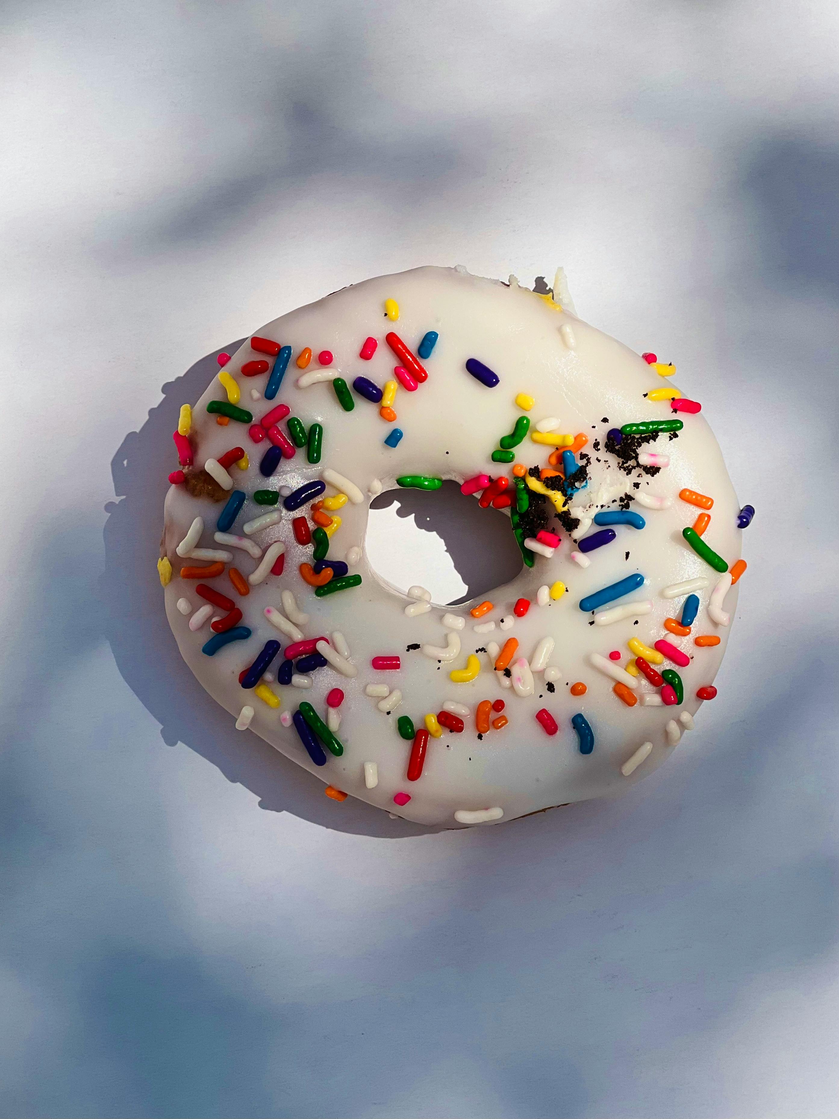 White Topped Doughnut Beside Peanut Cupcake · Free Stock Photo