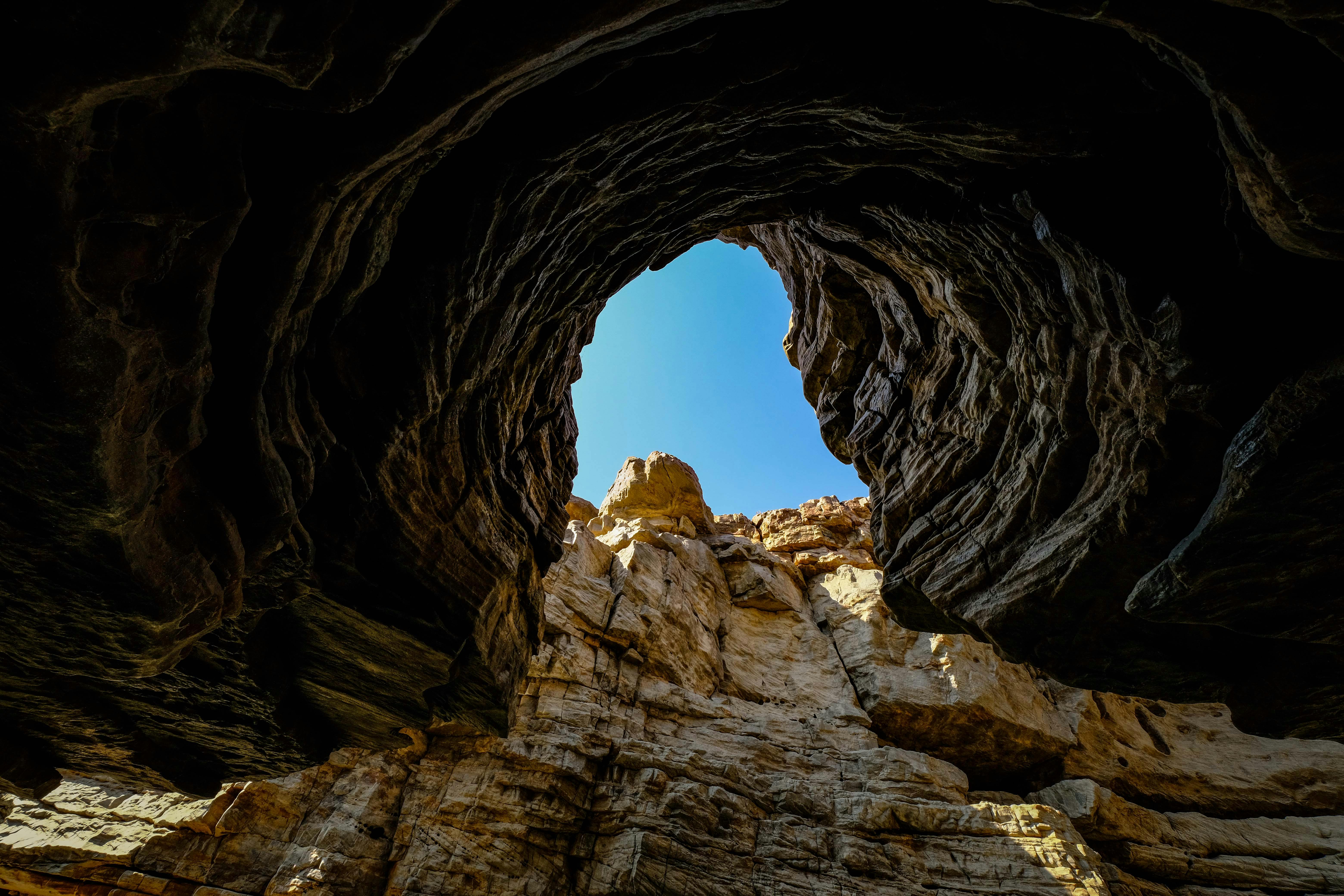 A view of a cave with a hole in it · Free Stock Photo