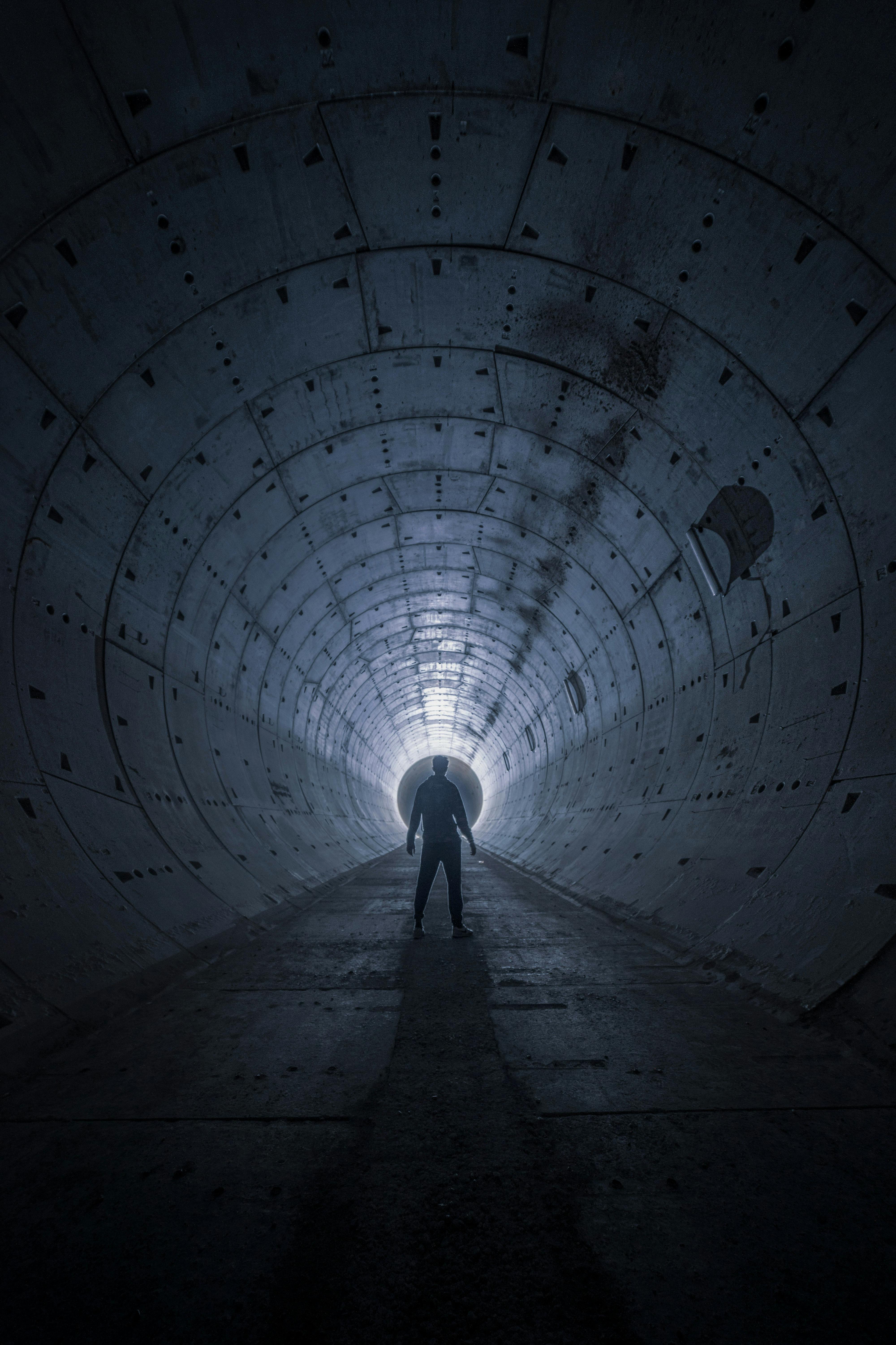 Man Standing in Tunnel · Free Stock Photo