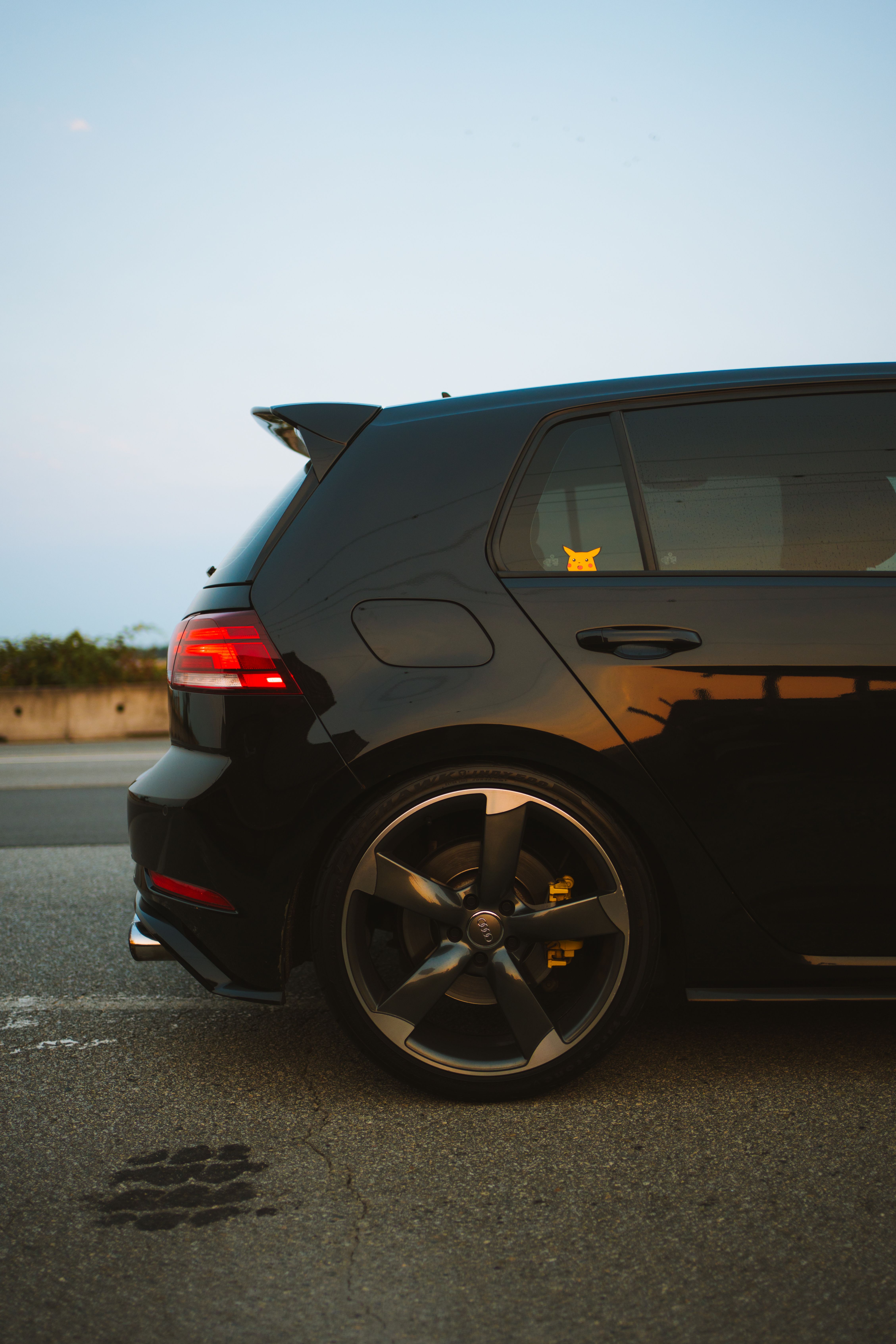 A black volkswagen golf r is parked on the side of the road · Free ...