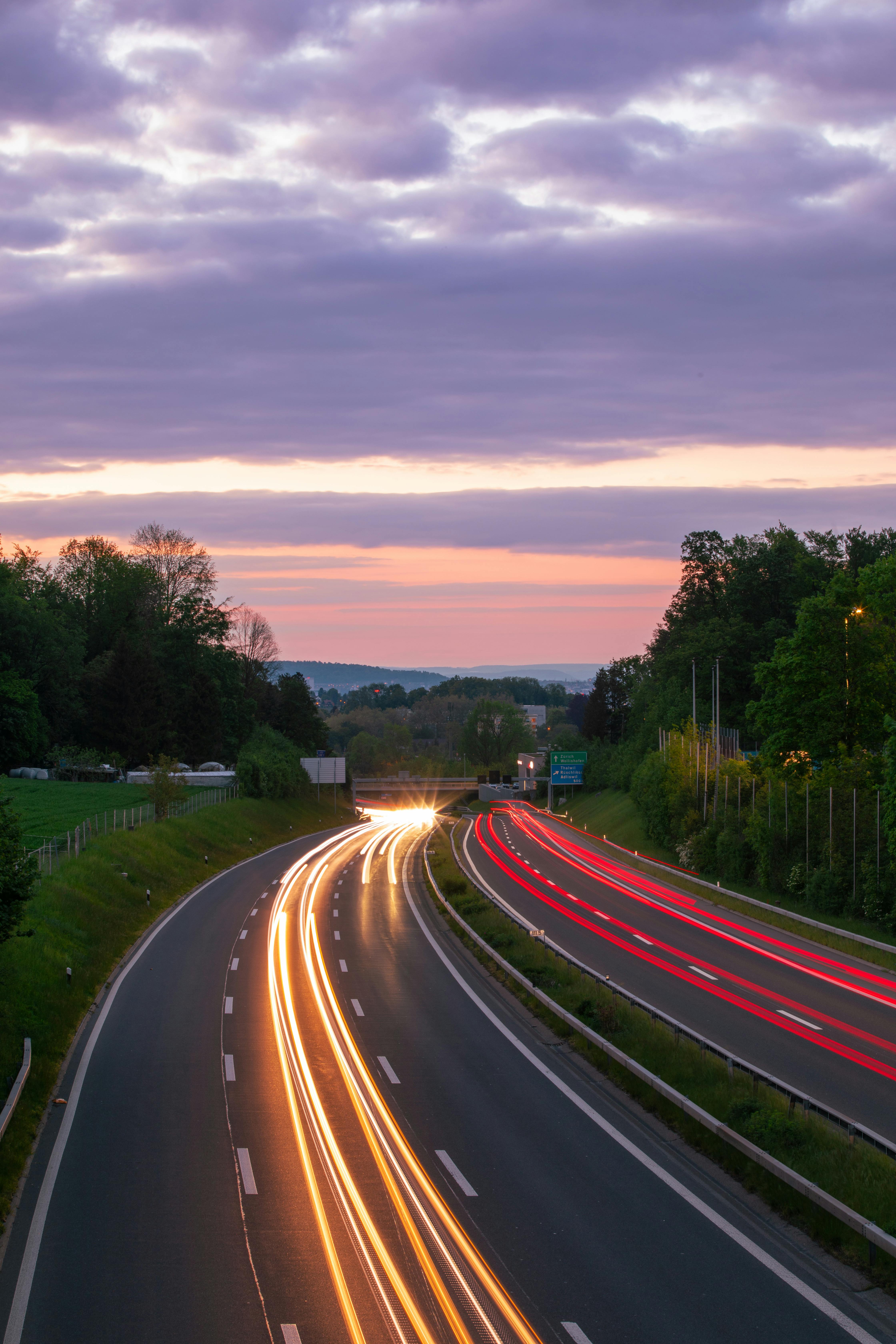 A highway with long streaks of light on it · Free Stock Photo