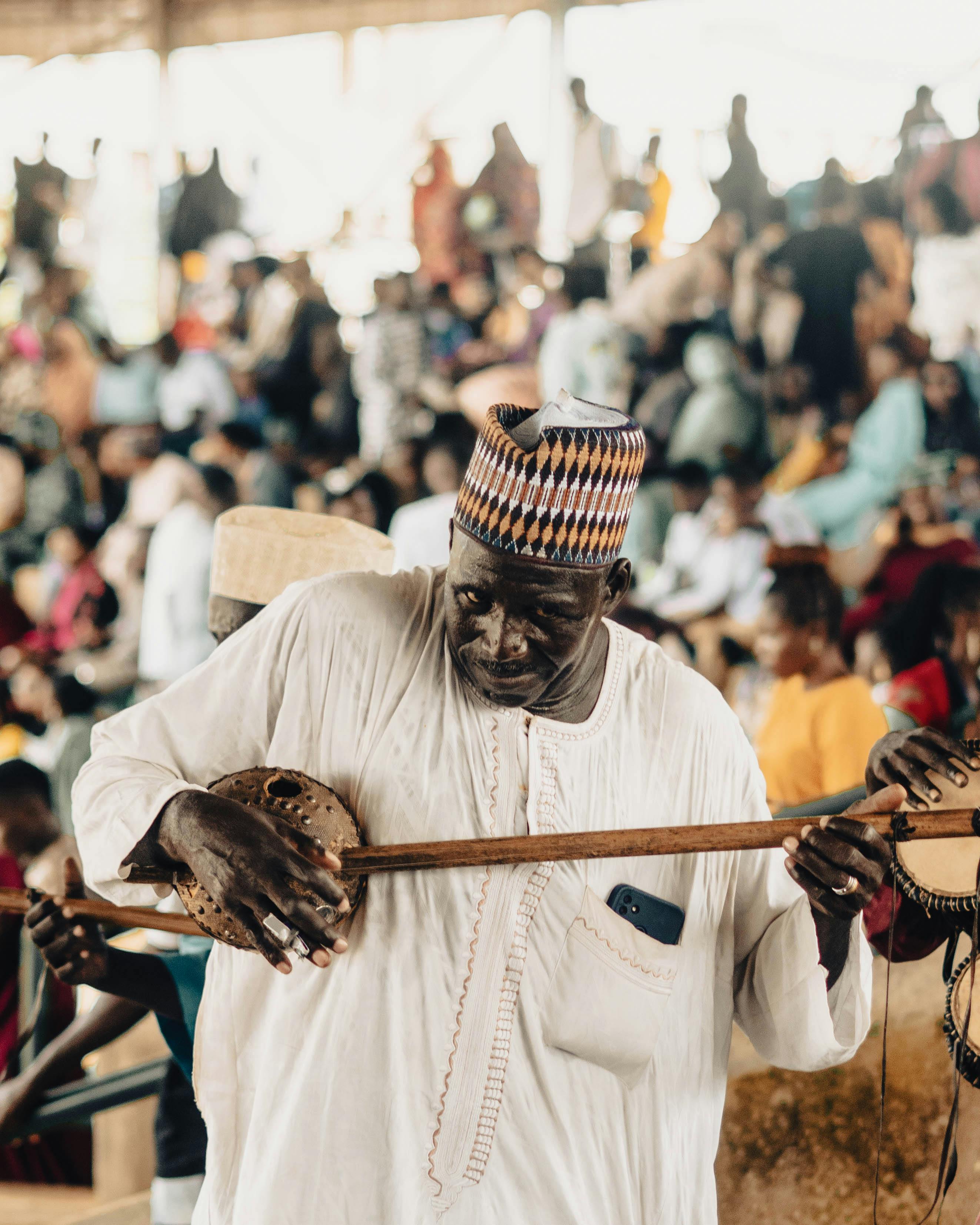 men in a traditional band playing local instruments · Free Stock Photo