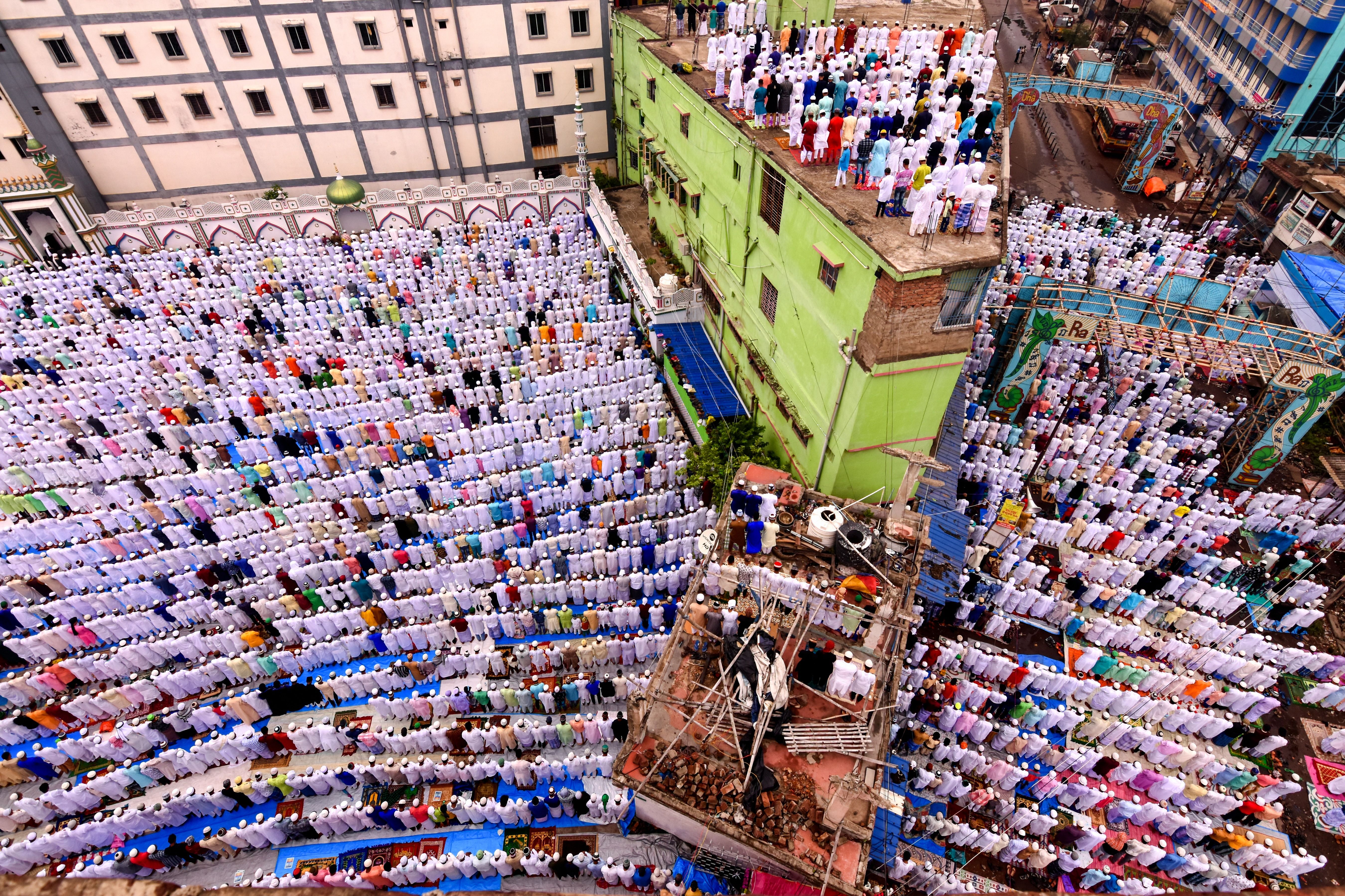 A large crowd of people standing in a large building · Free Stock Photo