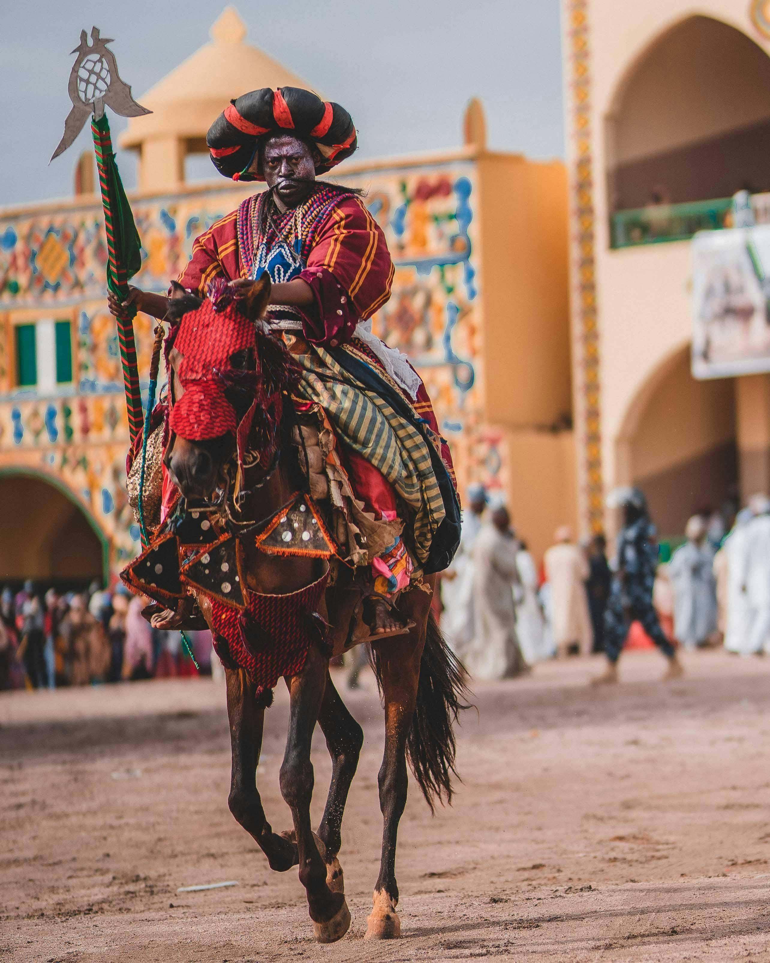 Man in Traditional Folklore Costume Riding Horse · Free Stock Photo