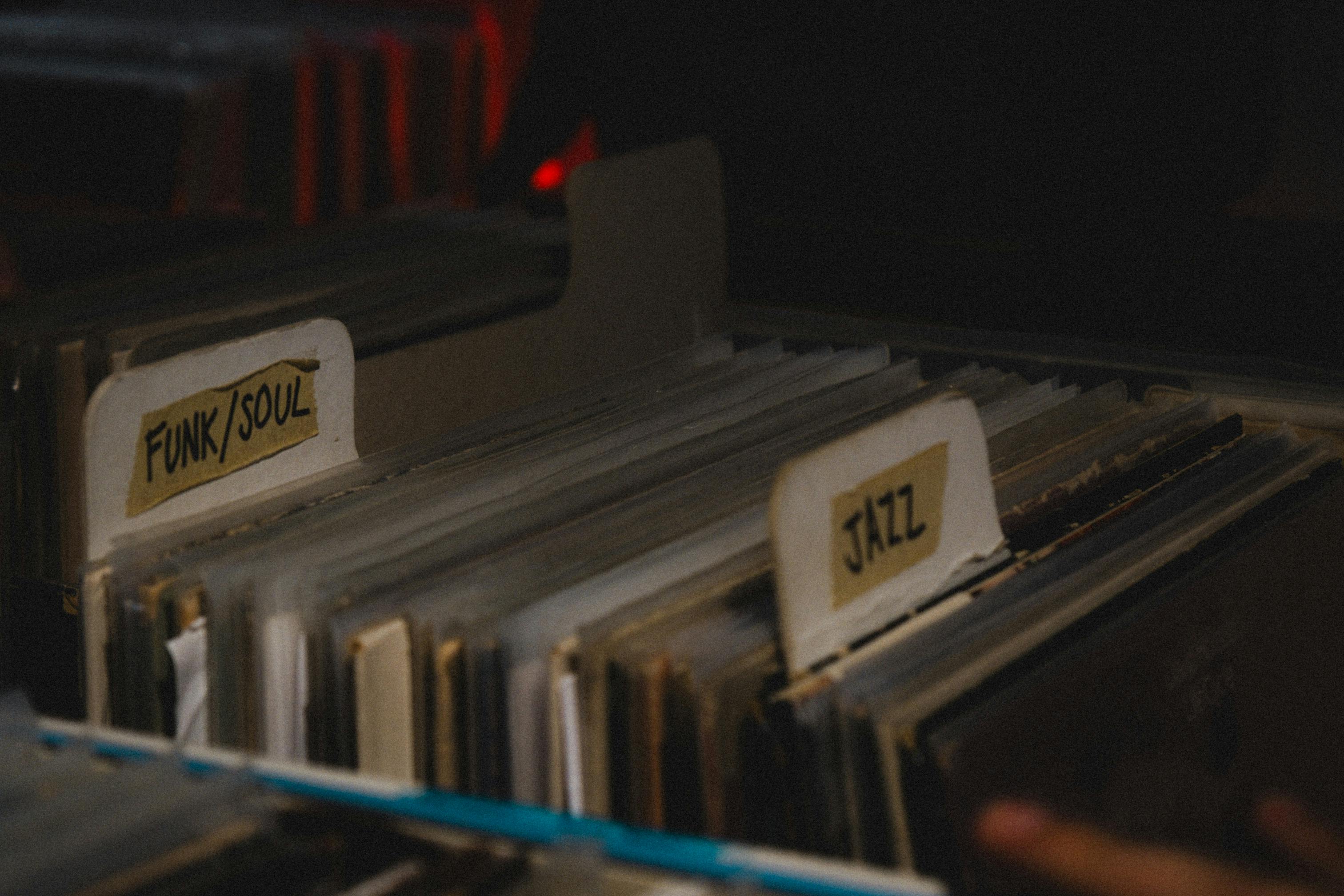 A person is holding a record player with a label on it · Free Stock Photo