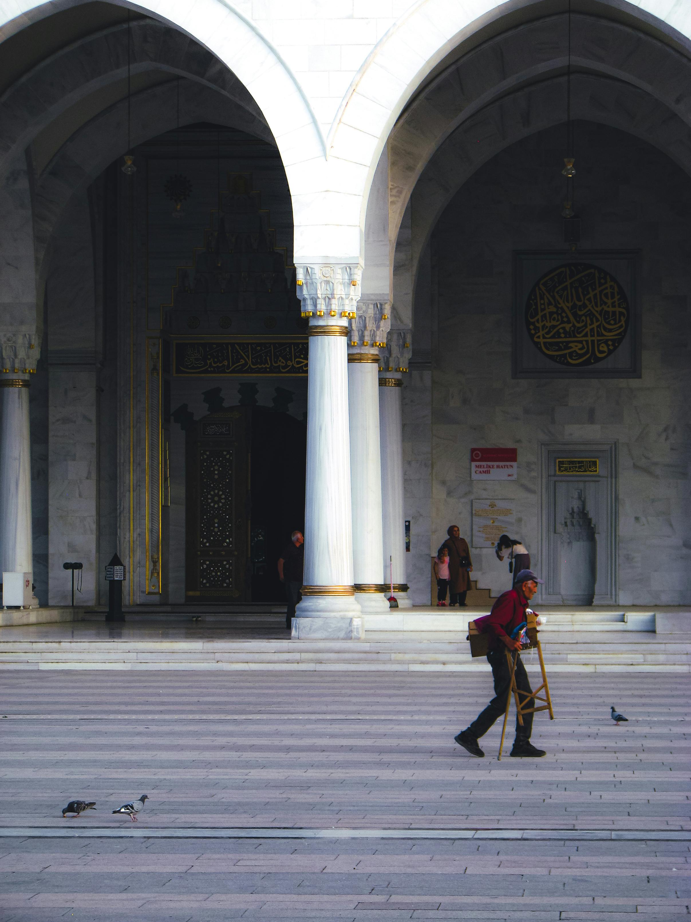 Man Posing in front of Mosque at Night · Free Stock Photo
