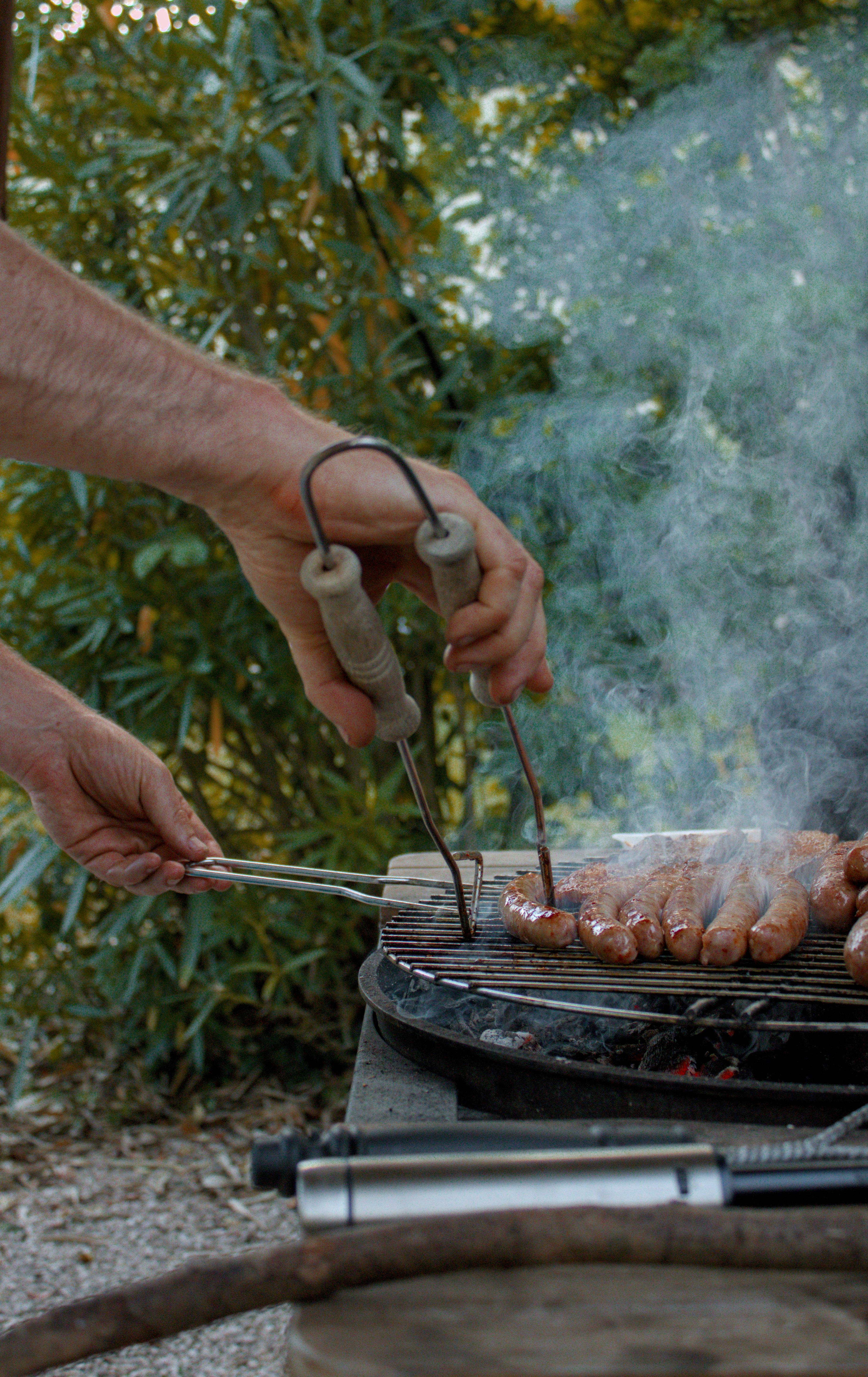 Close-Up Photo of Man Cooking Meat · Free Stock Photo