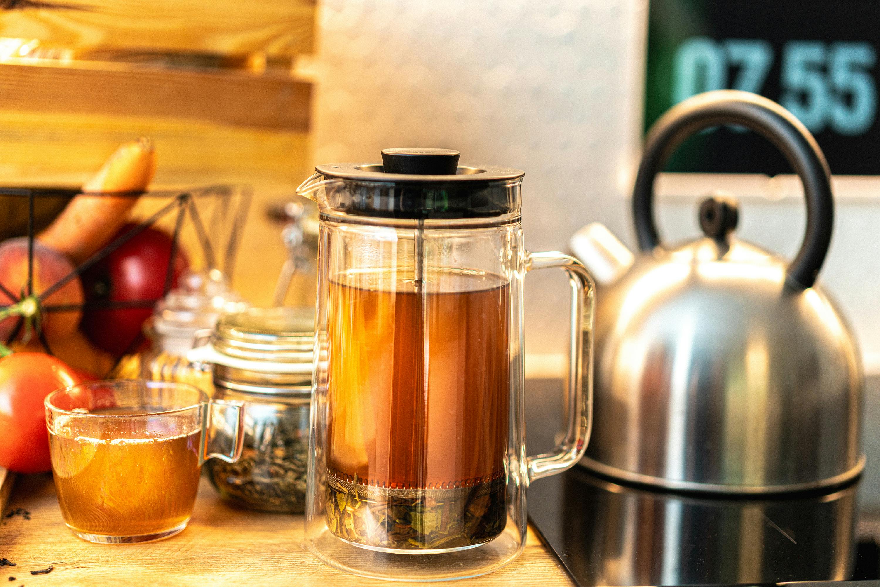 tea kettle with piston. Kitchen interior table. · Free Stock Photo