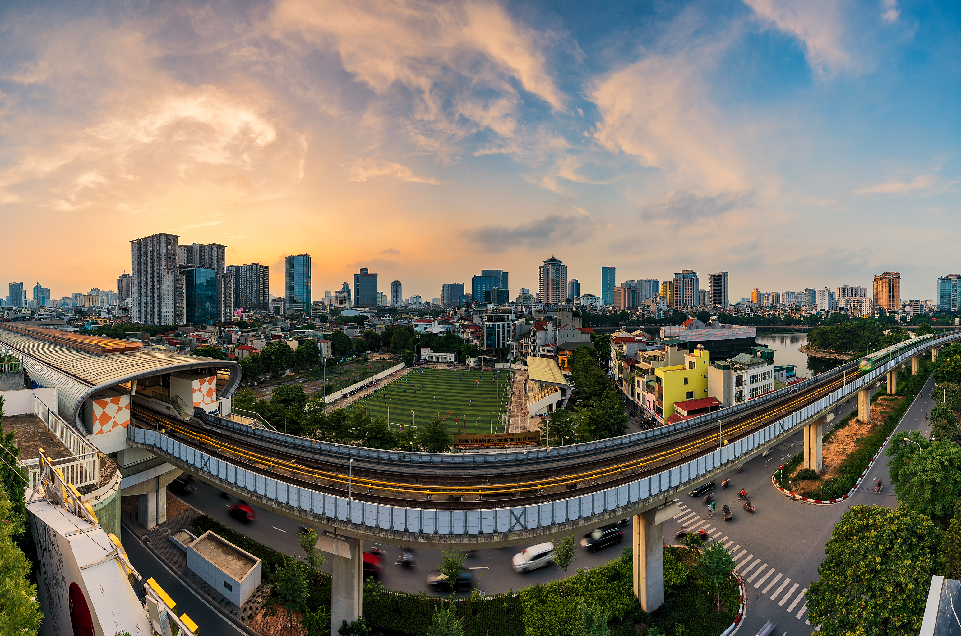 A train tracks and a city skyline at sunset · Free Stock Photo