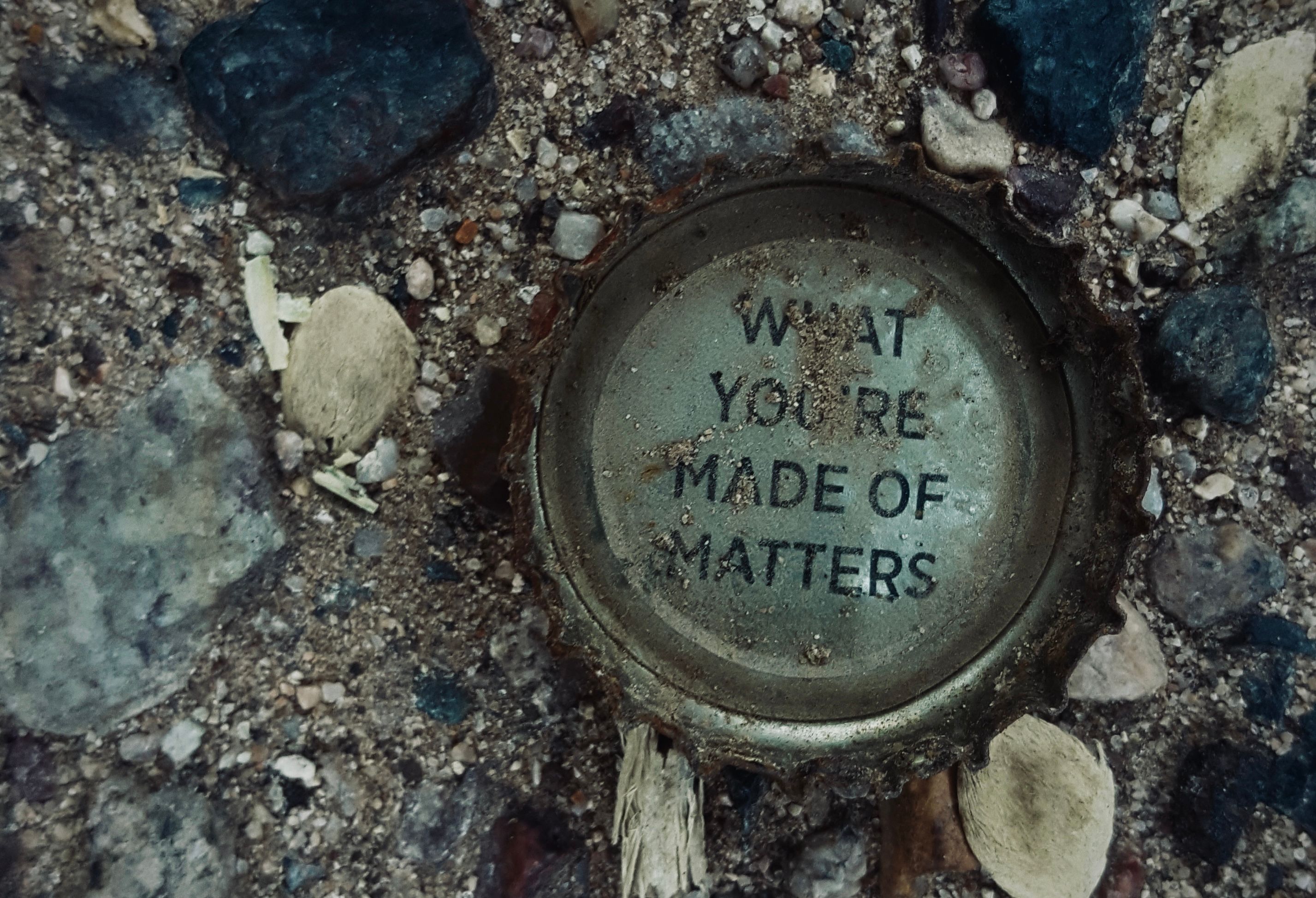 A bottle cap with what you're made of written on it · Free Stock Photo