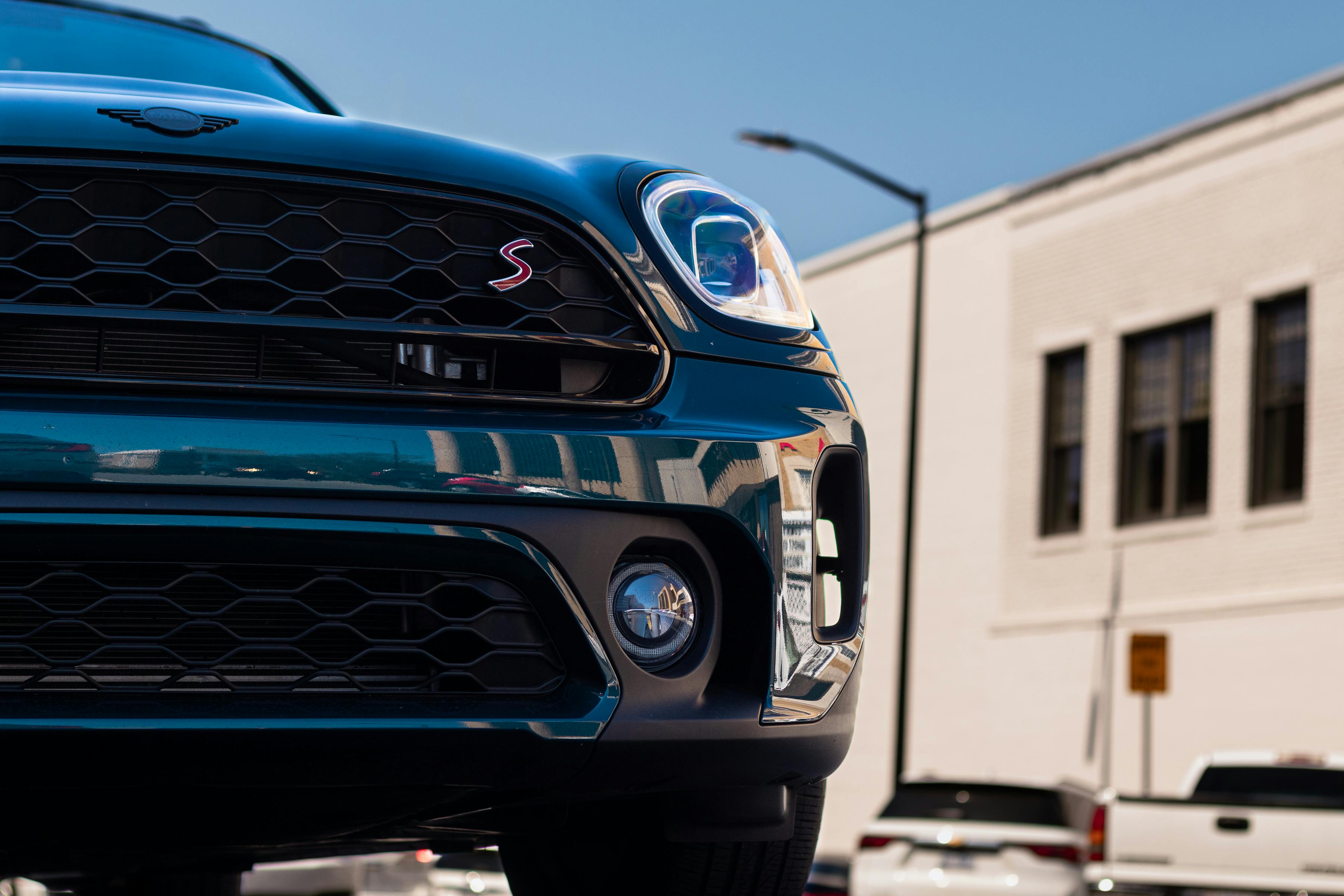The front end of a blue mini cooper · Free Stock Photo