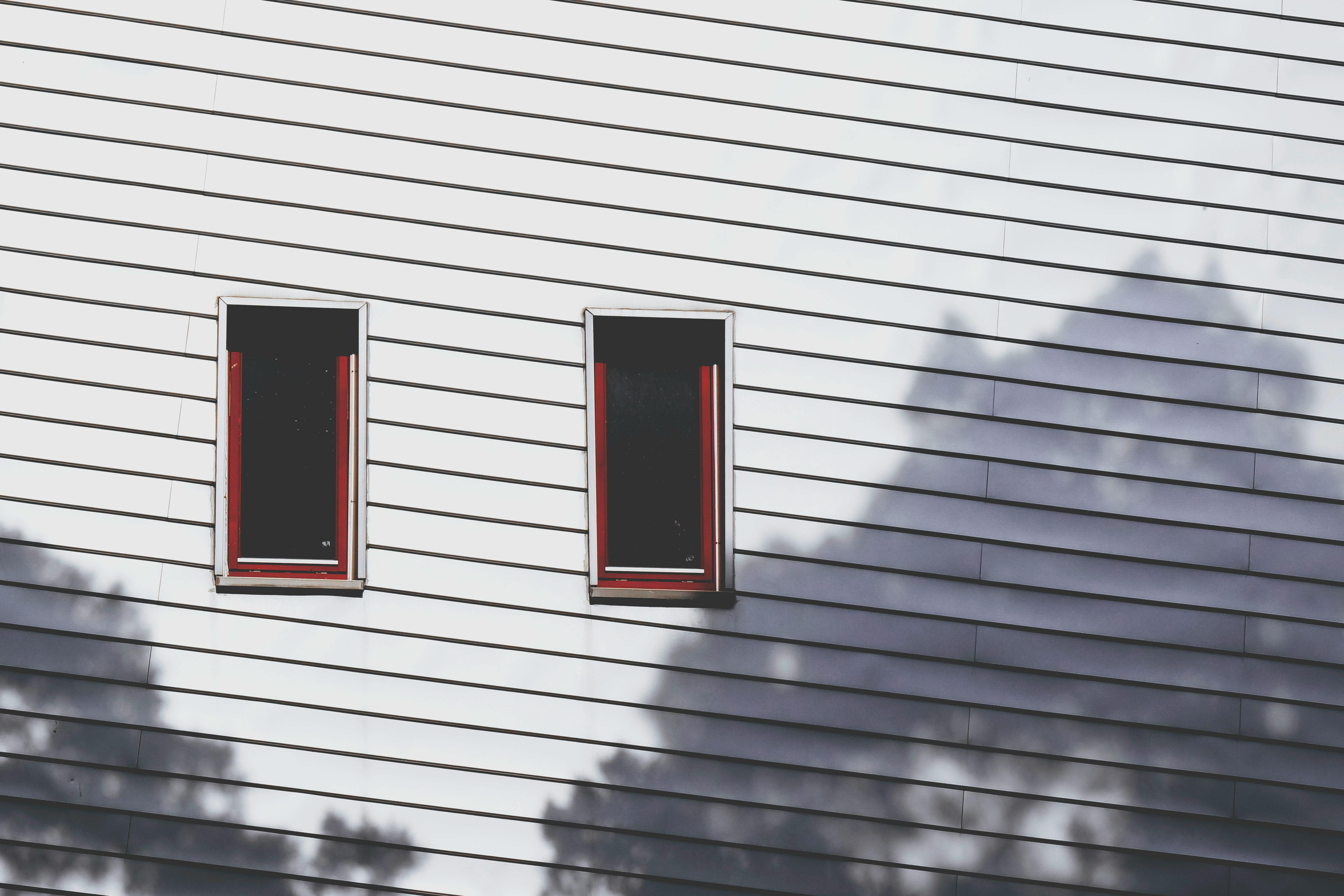 Two Windows On A Wooden Wall · Free Stock Photo