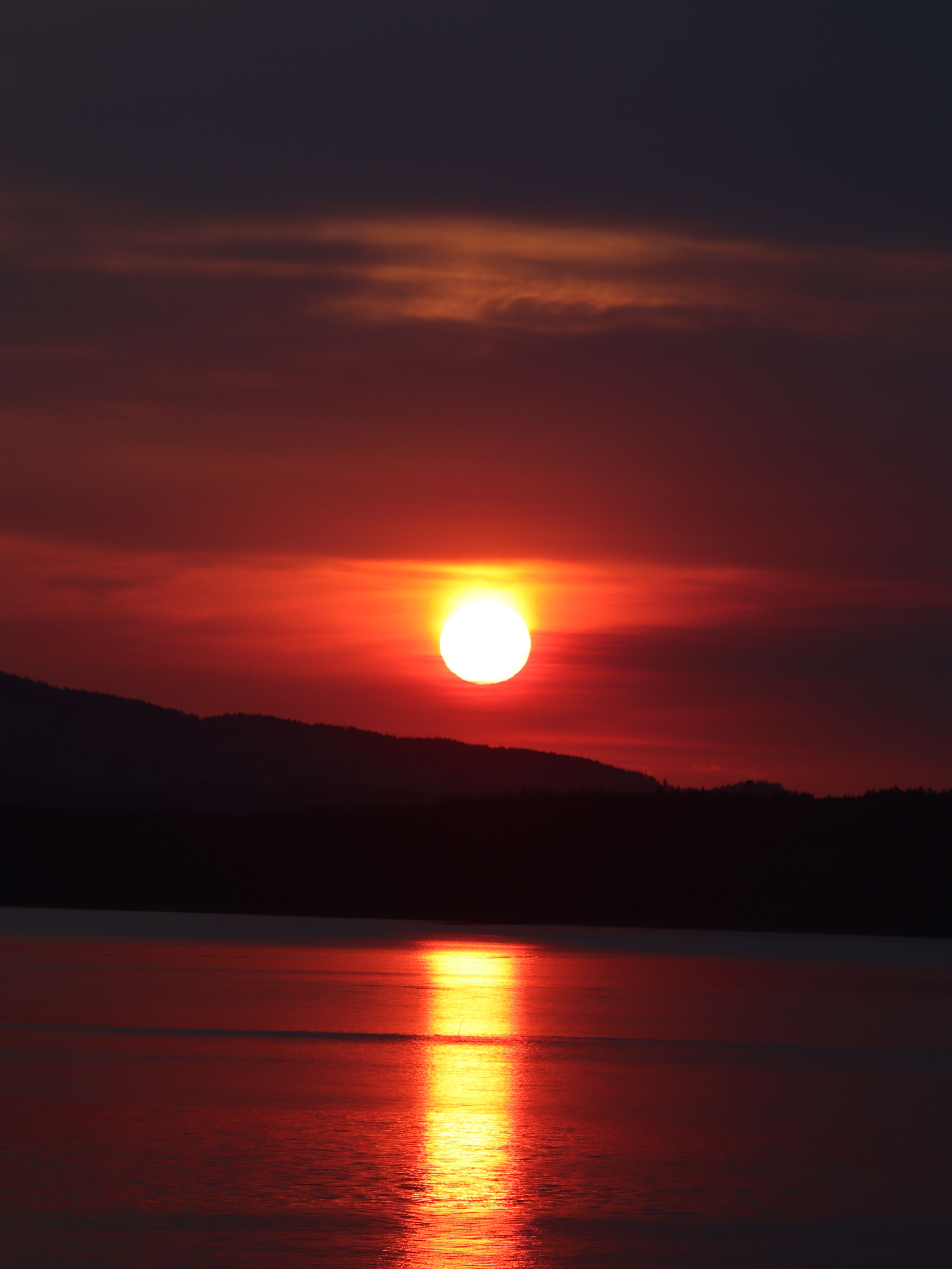 Red Sky Sunset Over Majestic Mountains and Ocean · Free Stock Photo