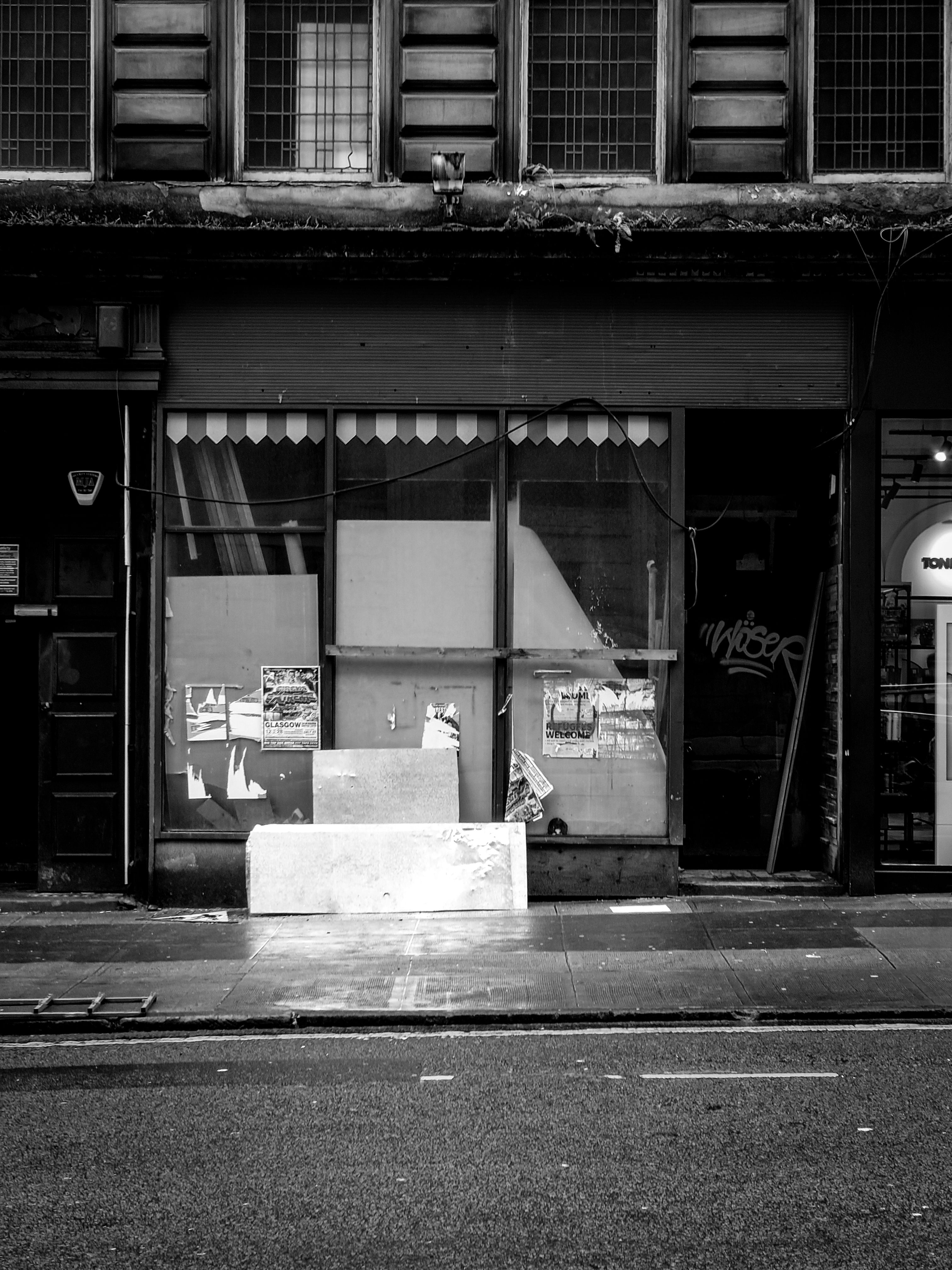 A black and white photo of a store front · Free Stock Photo
