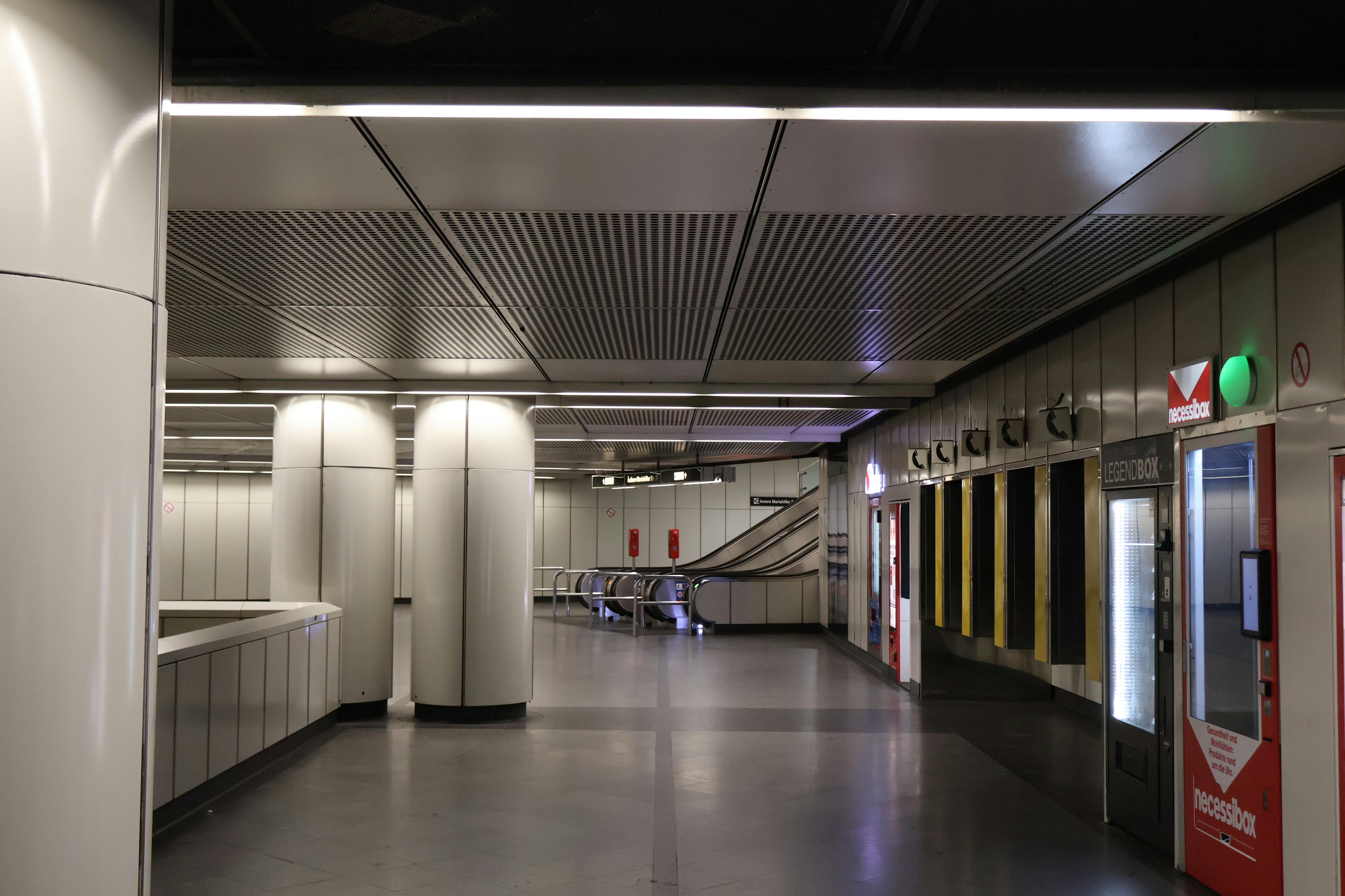 A subway station with a long hallway and a lighted ceiling · Free Stock ...