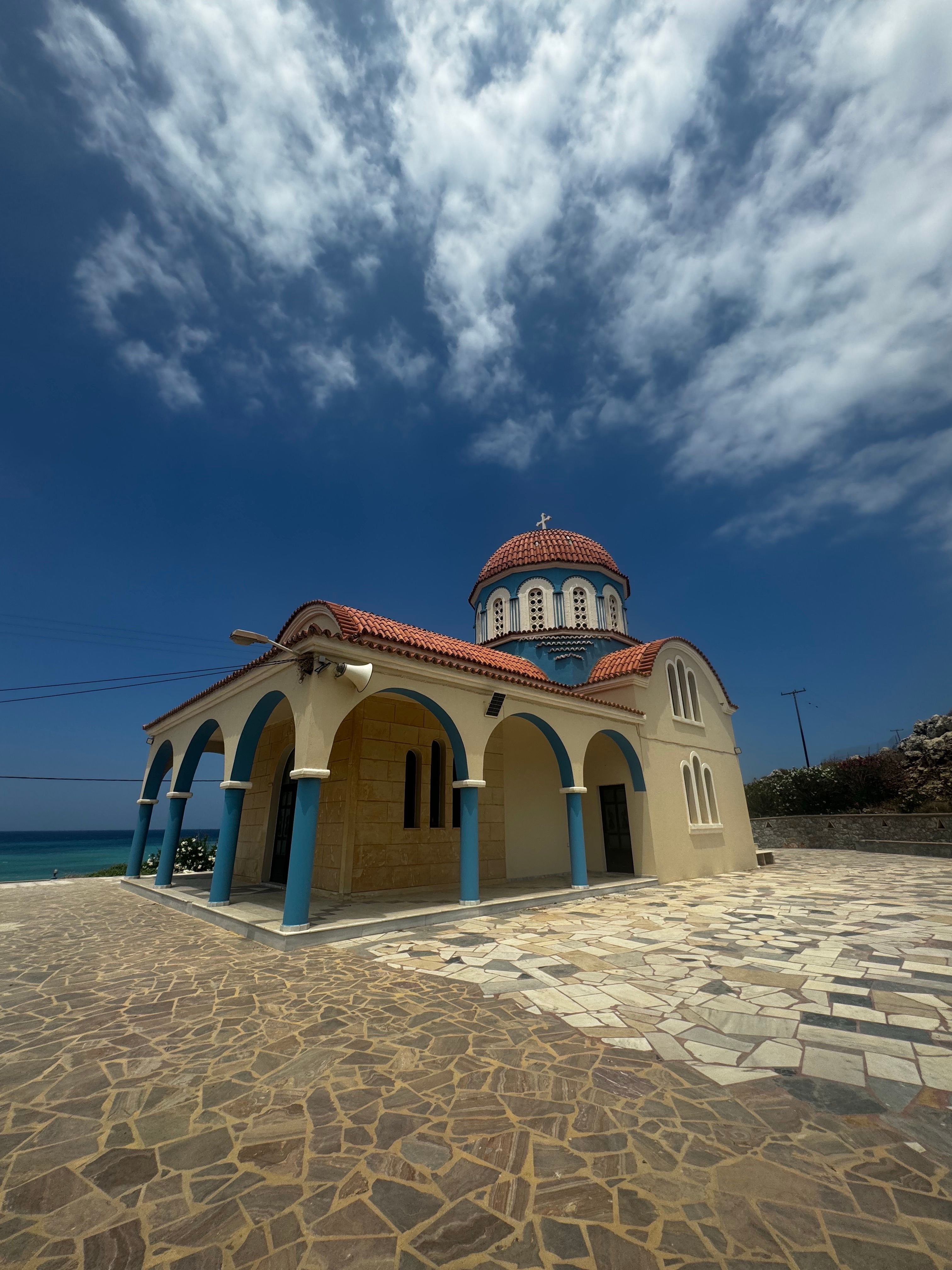A small church on the beach with blue sky · Free Stock Photo