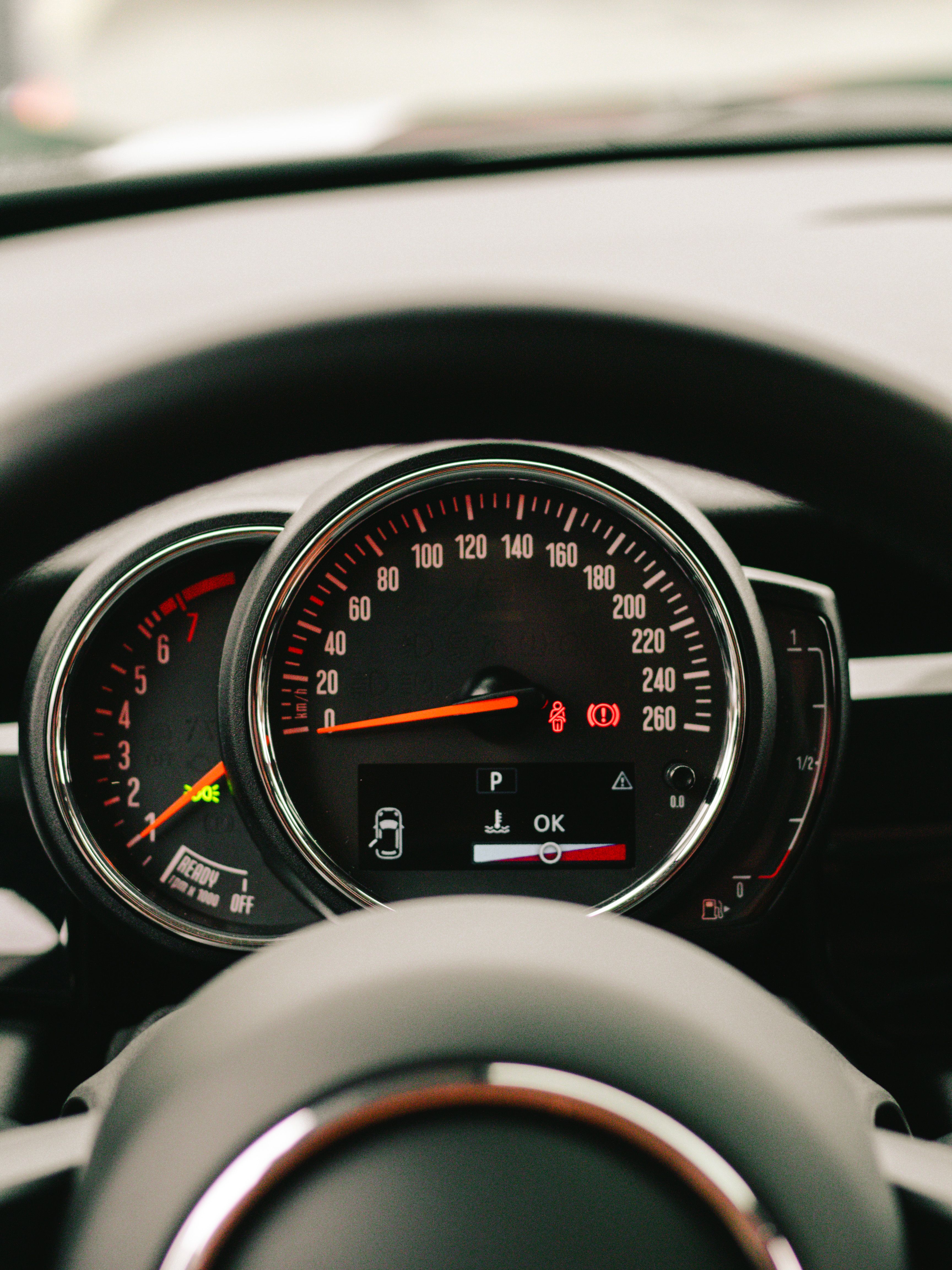 A dashboard with a speedometer and a gauge · Free Stock Photo