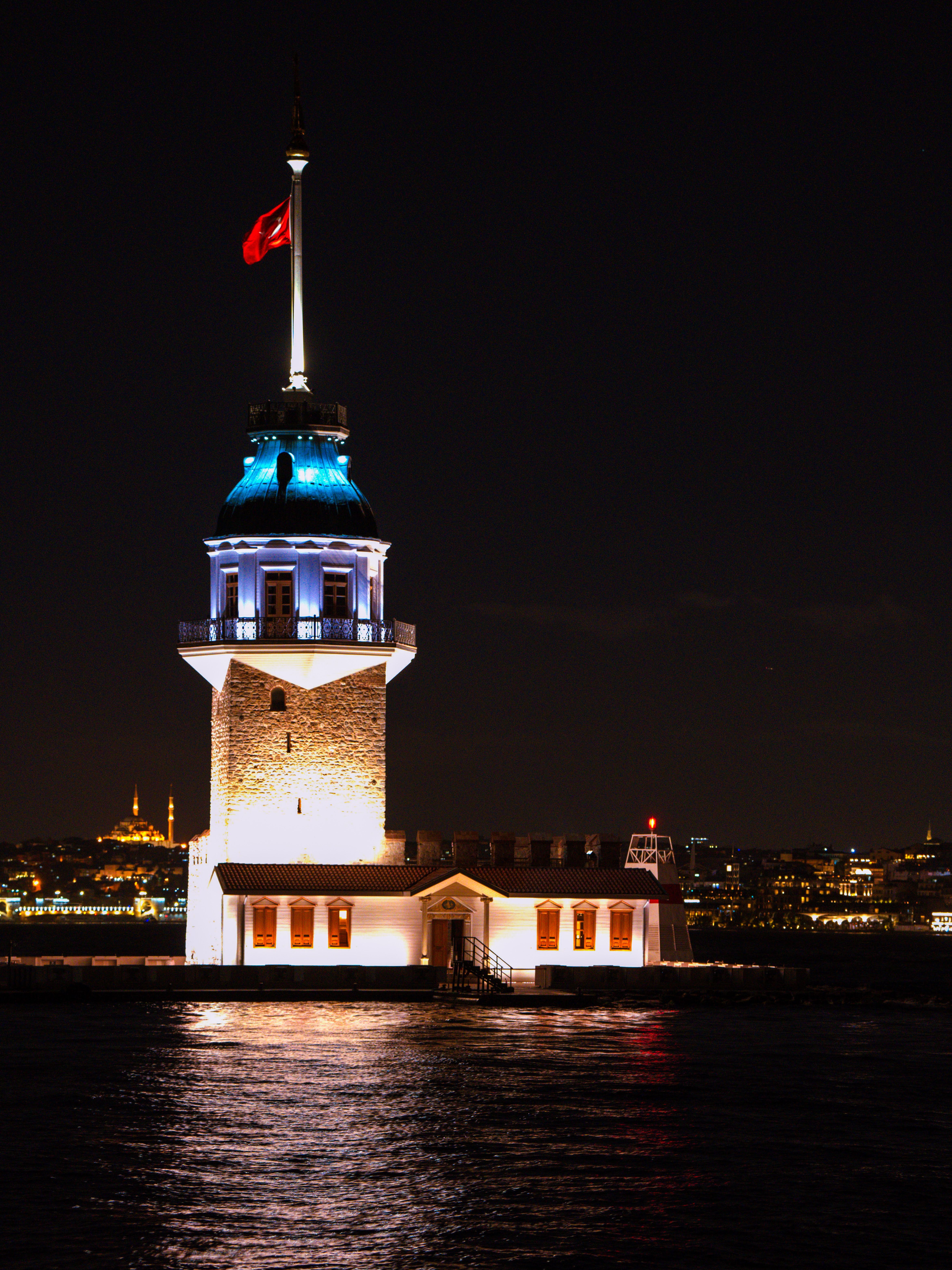 The blue tower is lit up at night · Free Stock Photo