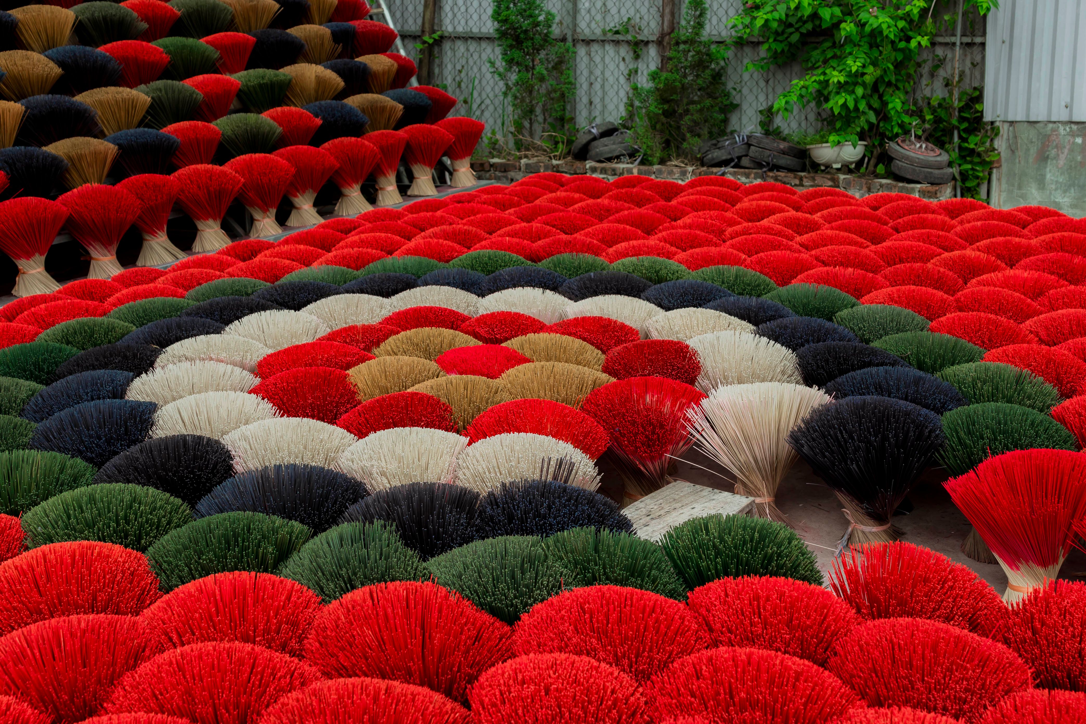 A bunch of red, black, and white fans · Free Stock Photo