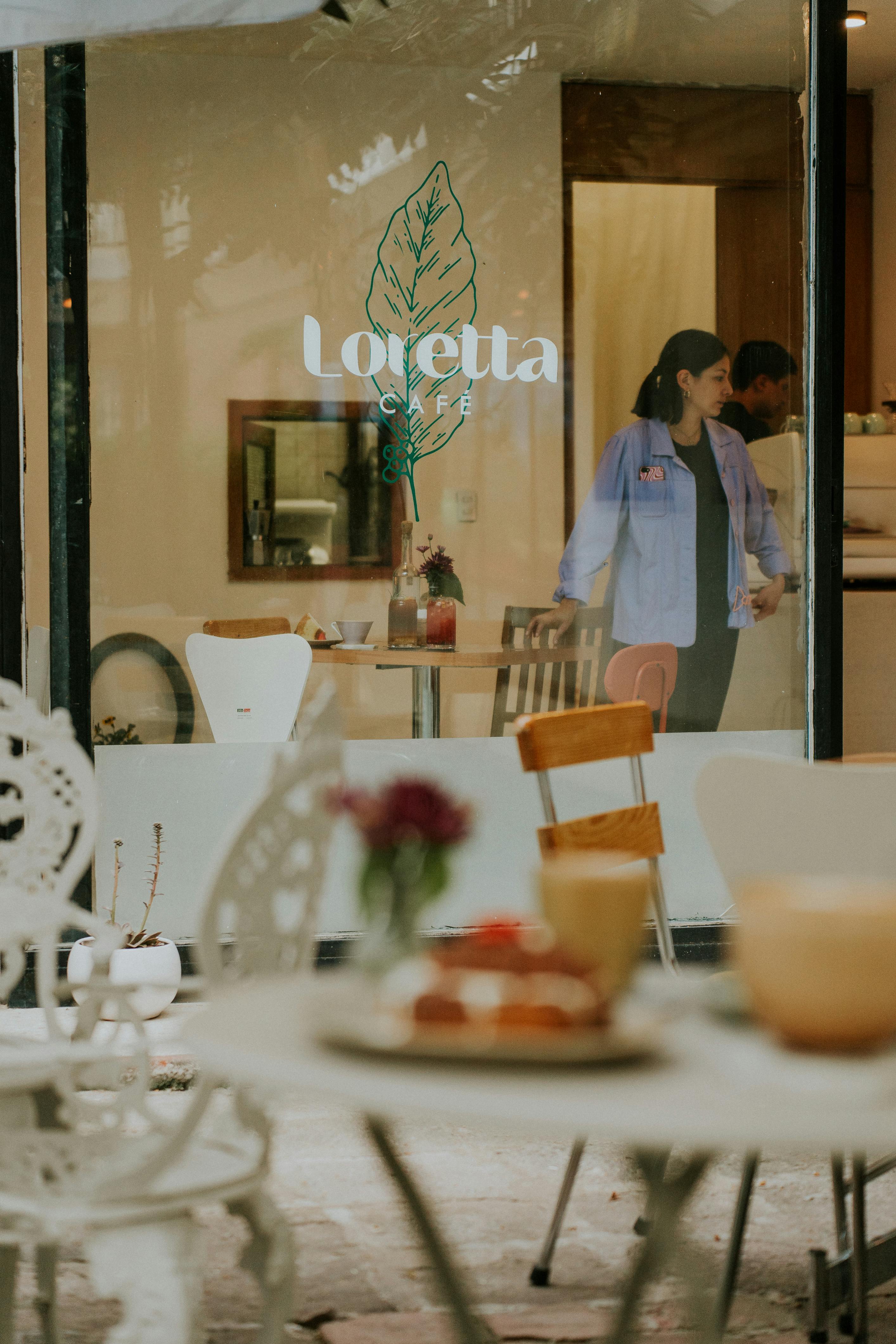 A restaurant with a sign that says lotta · Free Stock Photo