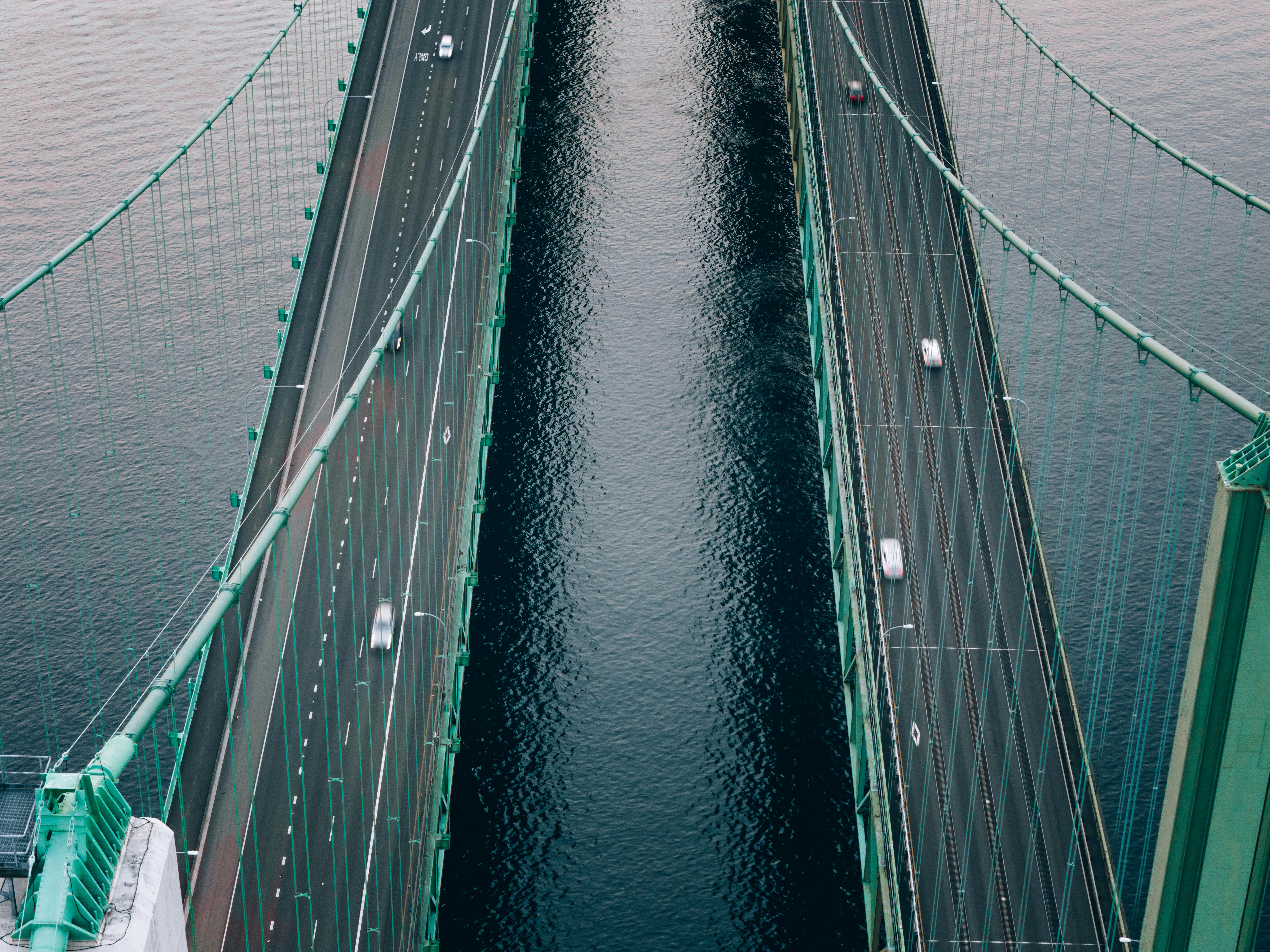 A bridge is shown from above with cars driving on it · Free Stock Photo