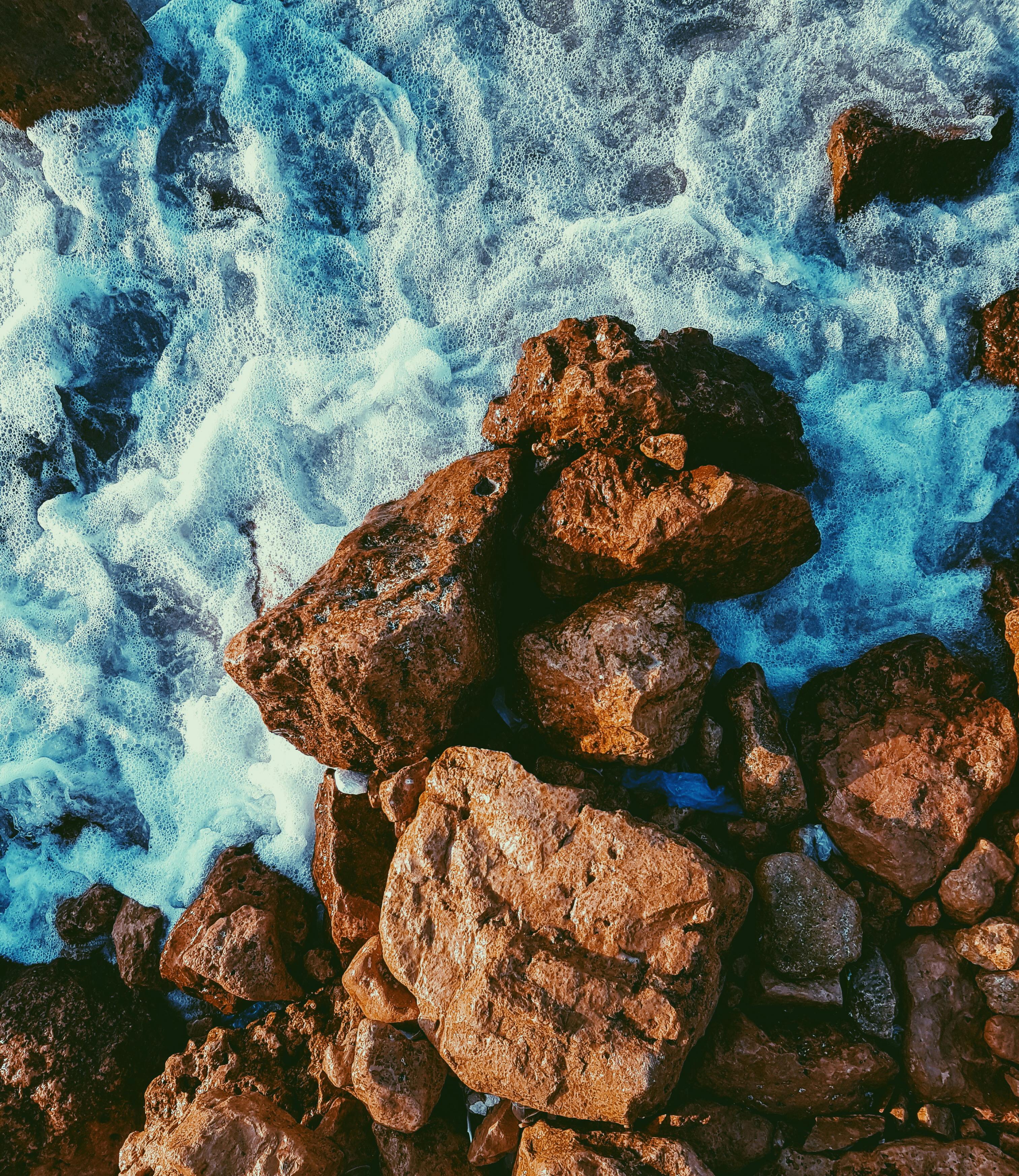 waves clashing with stones · Free Stock Photo