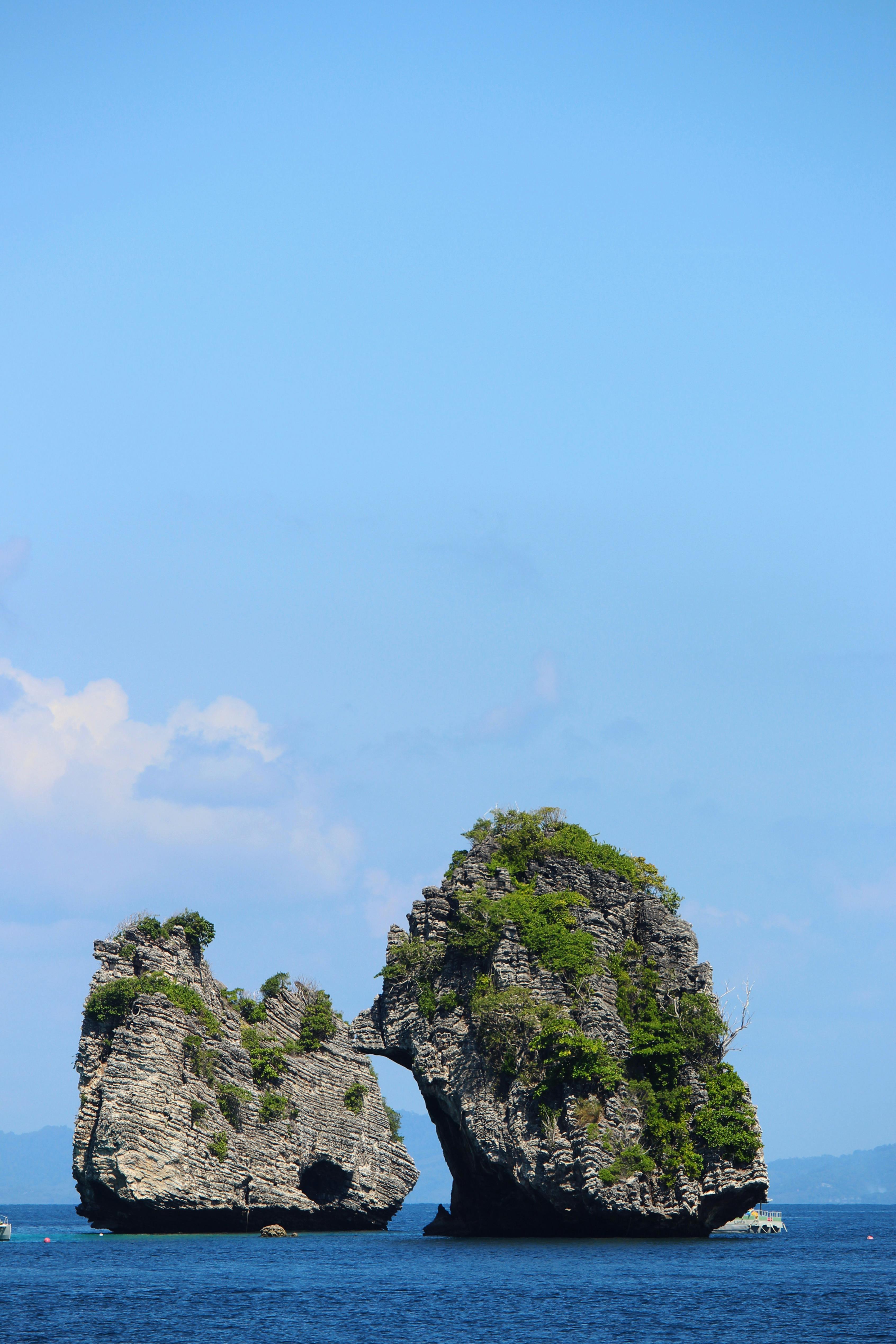Two large rock formations in the ocean · Free Stock Photo