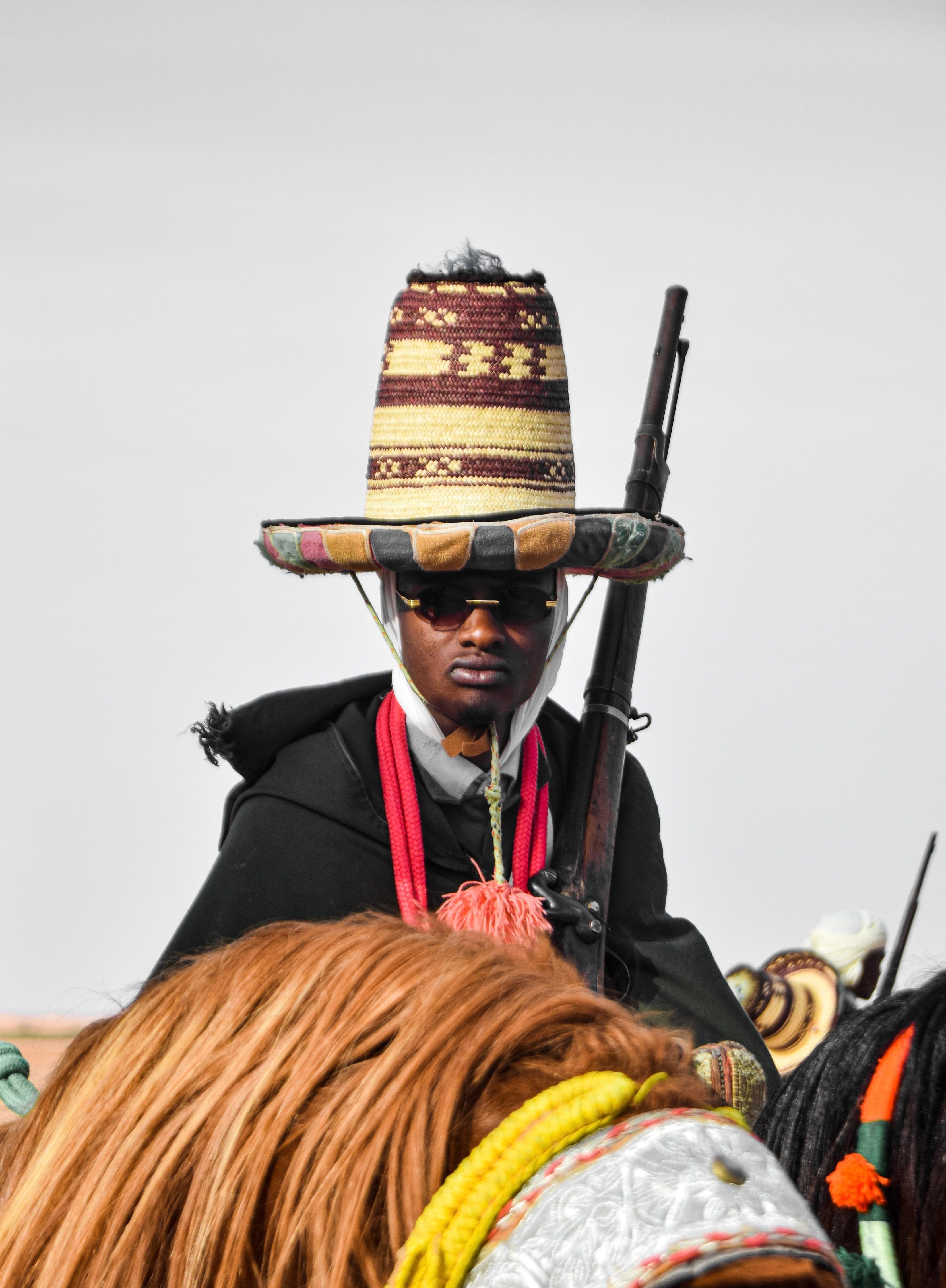 Man in Traditional Clothing and with Rifle · Free Stock Photo