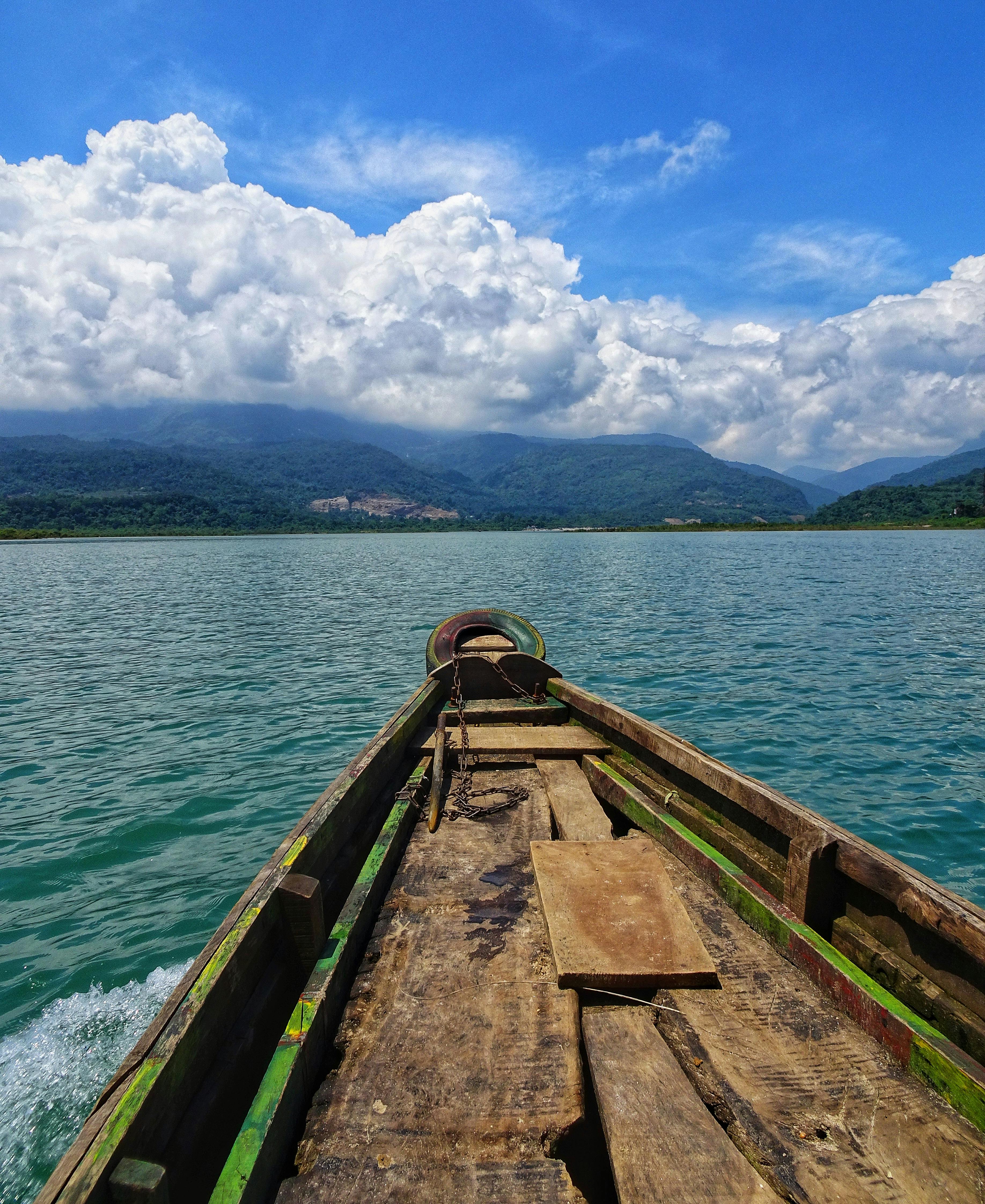 Aerial View Black Wooden Row Boat on Body of Water · Free Stock Photo