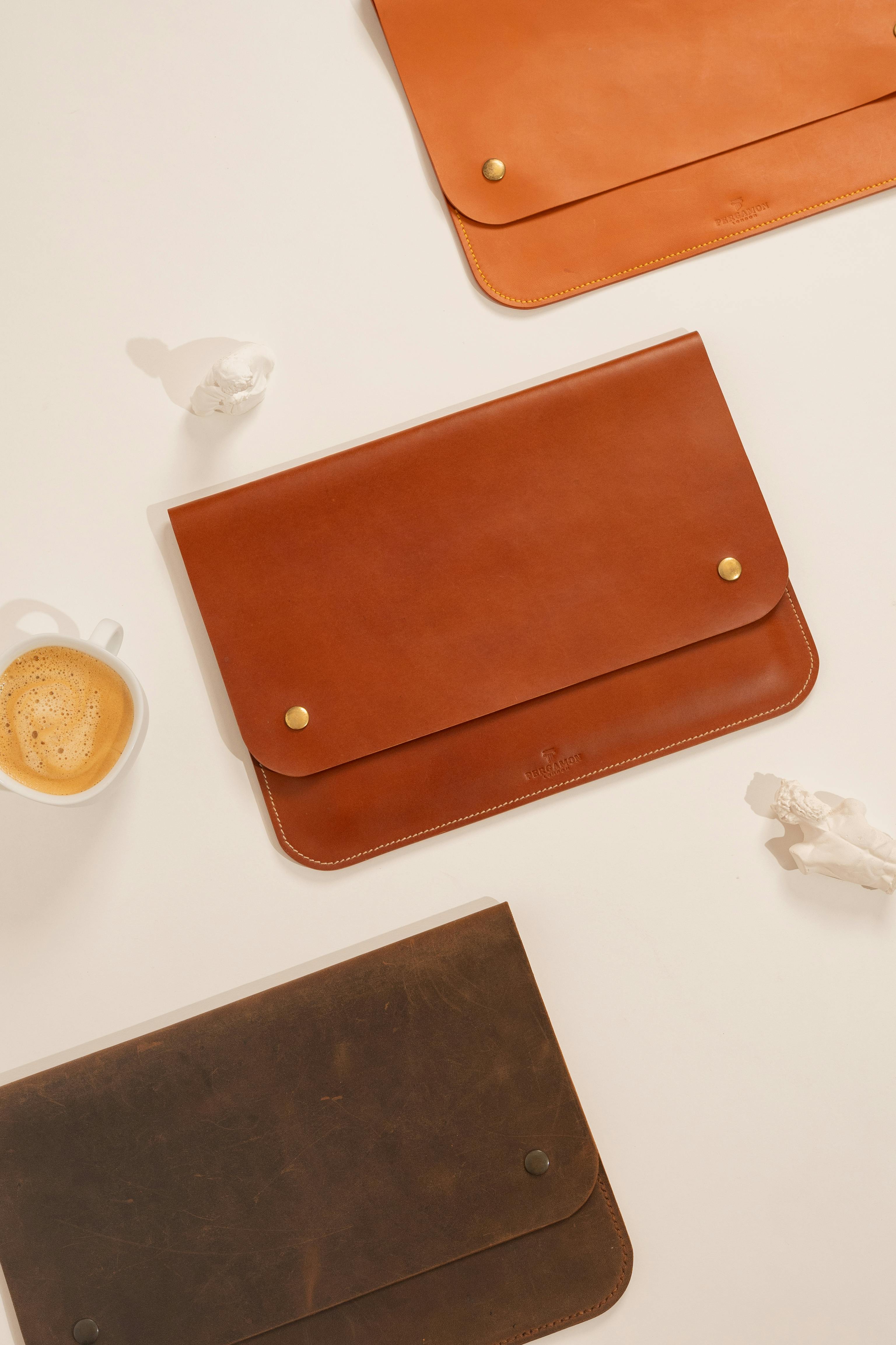 Leather Wallets and Cup of Coffee · Free Stock Photo
