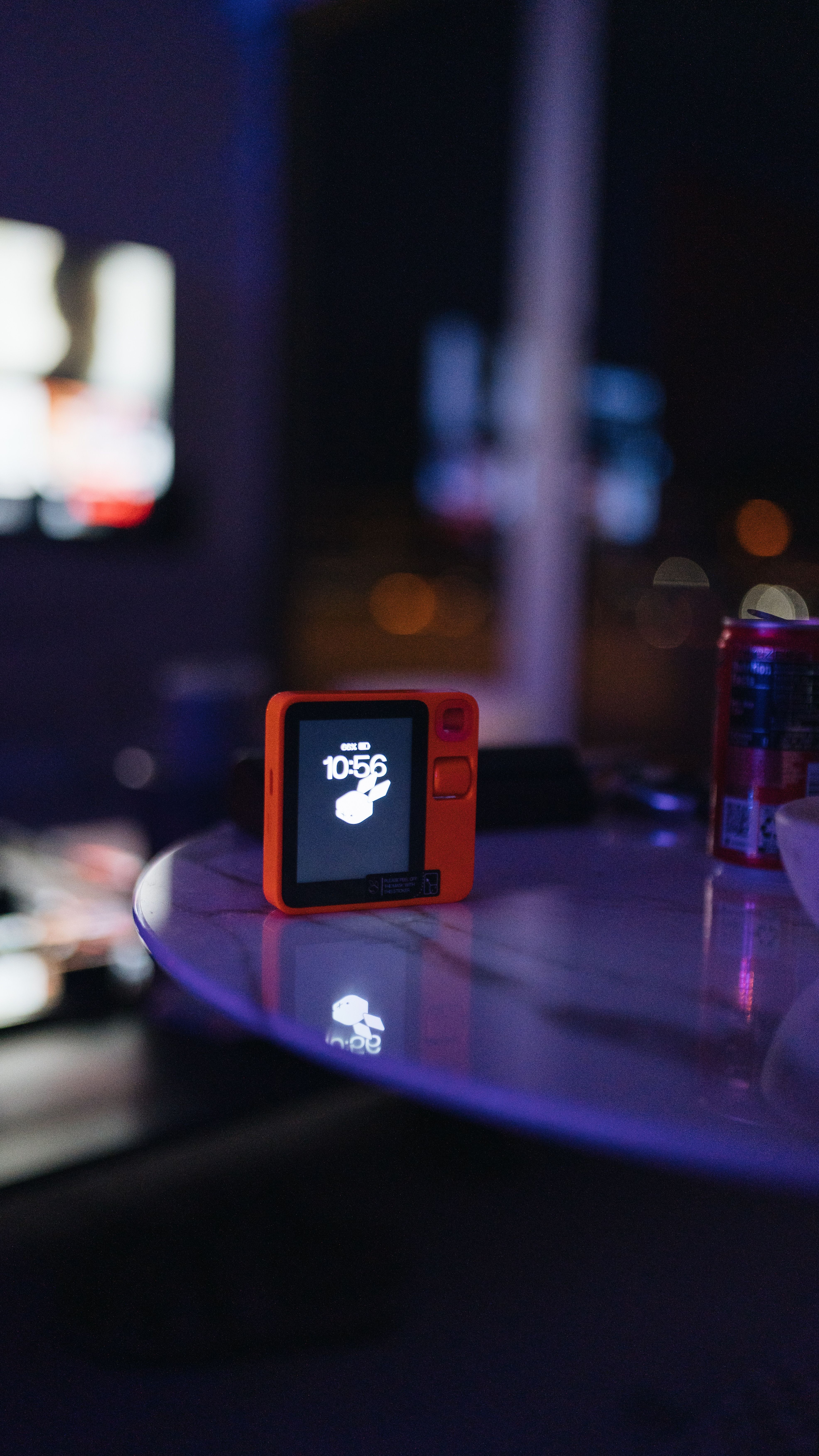 A small orange game boy sitting on a table · Free Stock Photo