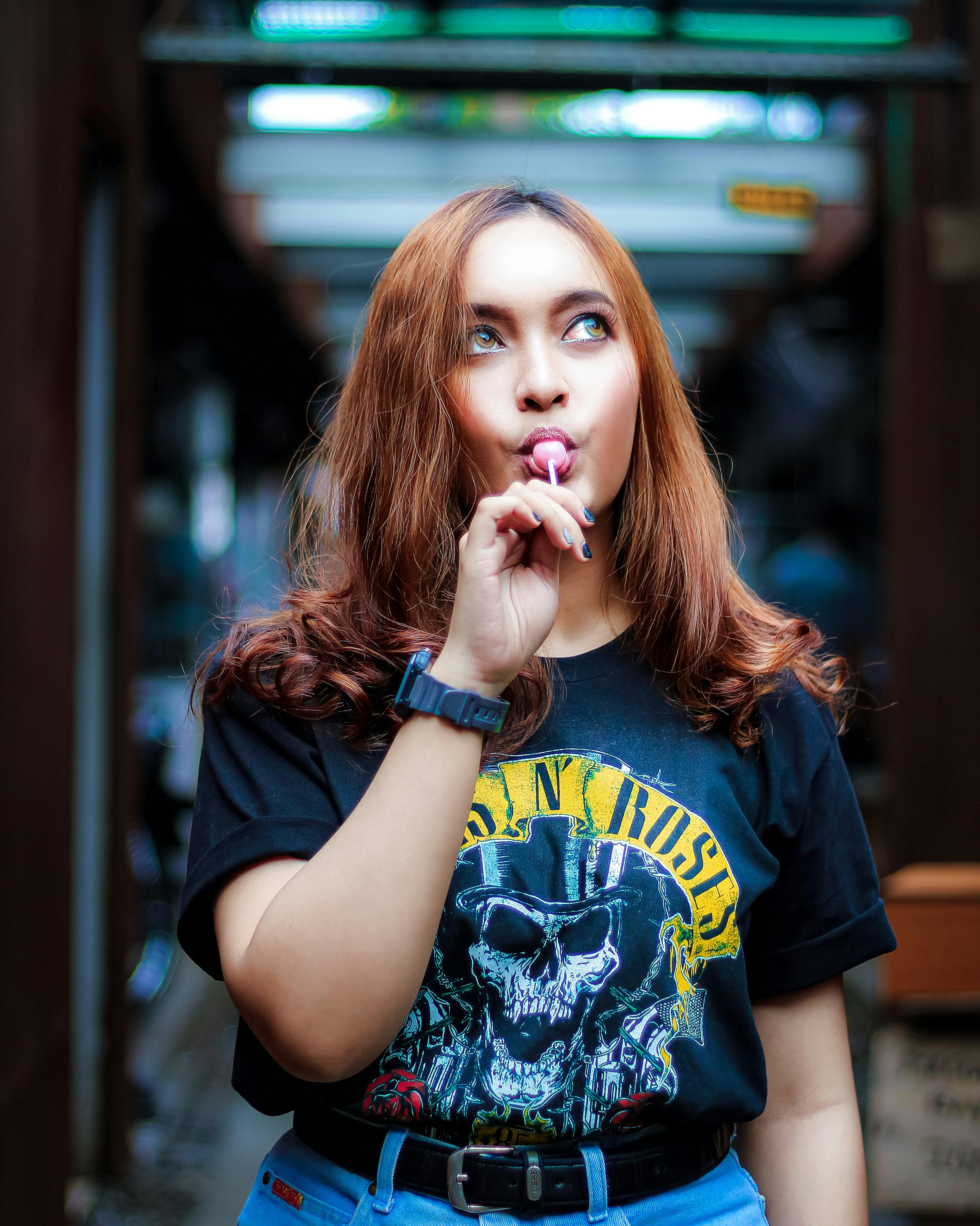 Photo Of Woman Eating Lollipop · Free Stock Photo