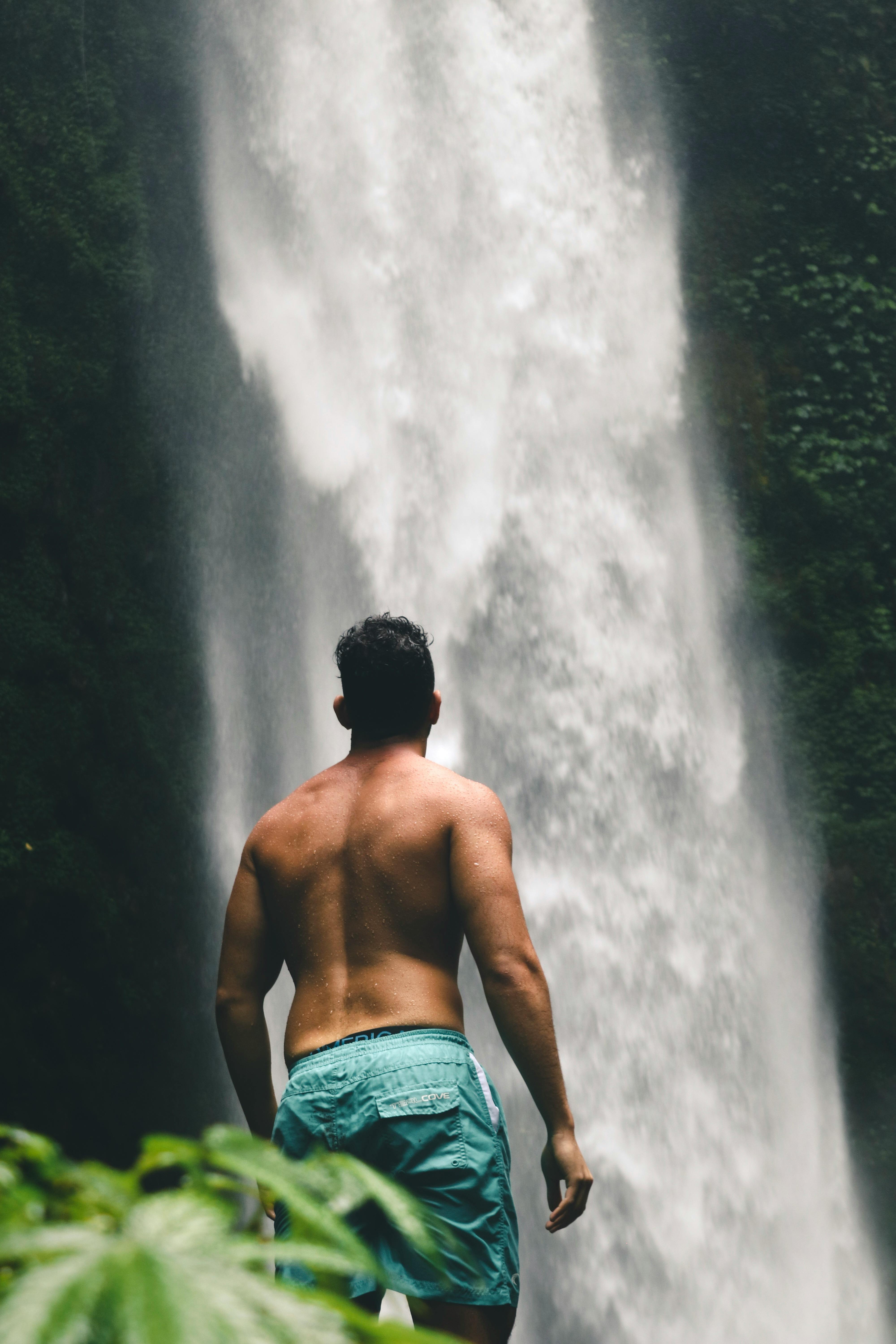 Man Looking at Waterfalls · Free Stock Photo