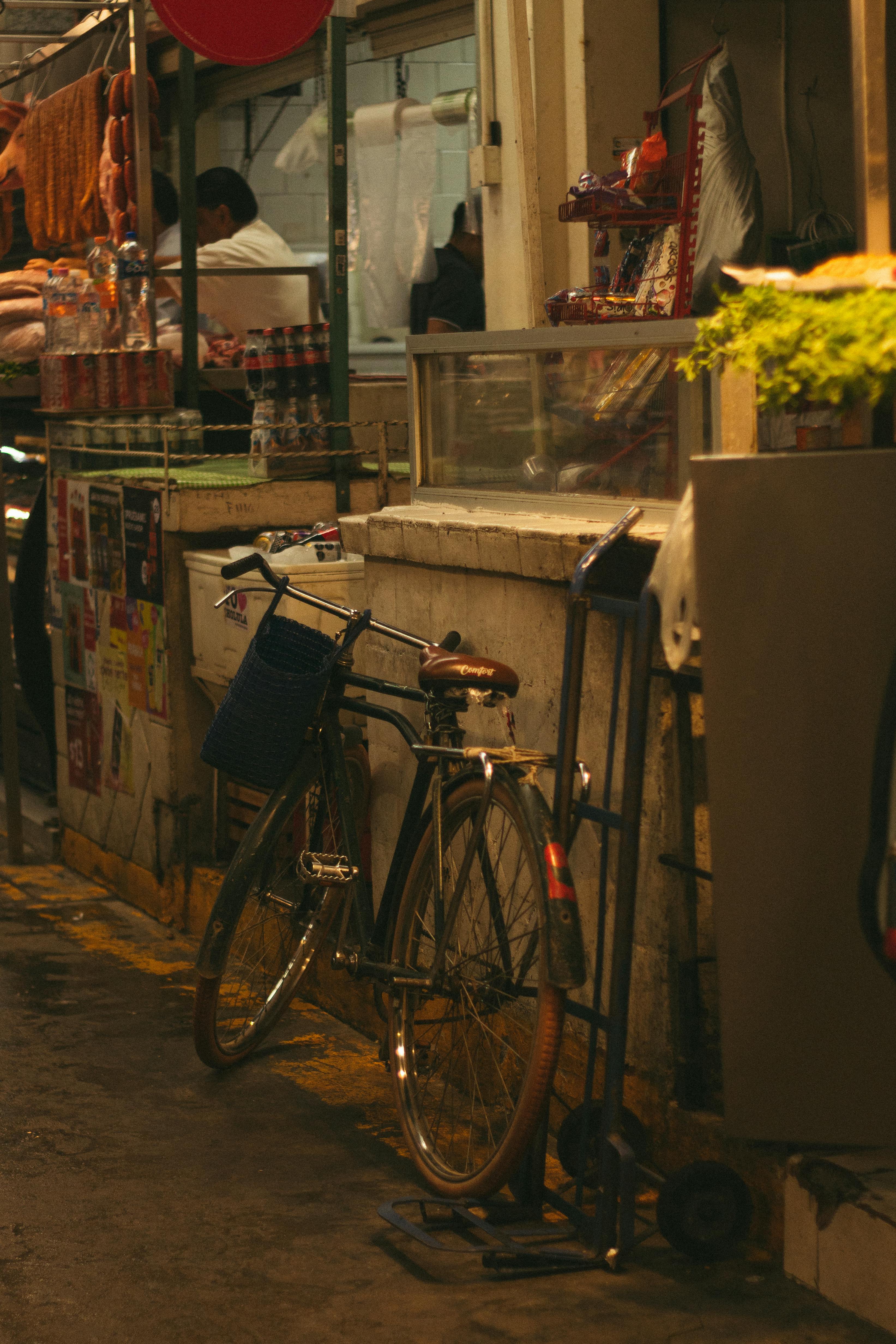 A bicycle parked in front of a store · Free Stock Photo