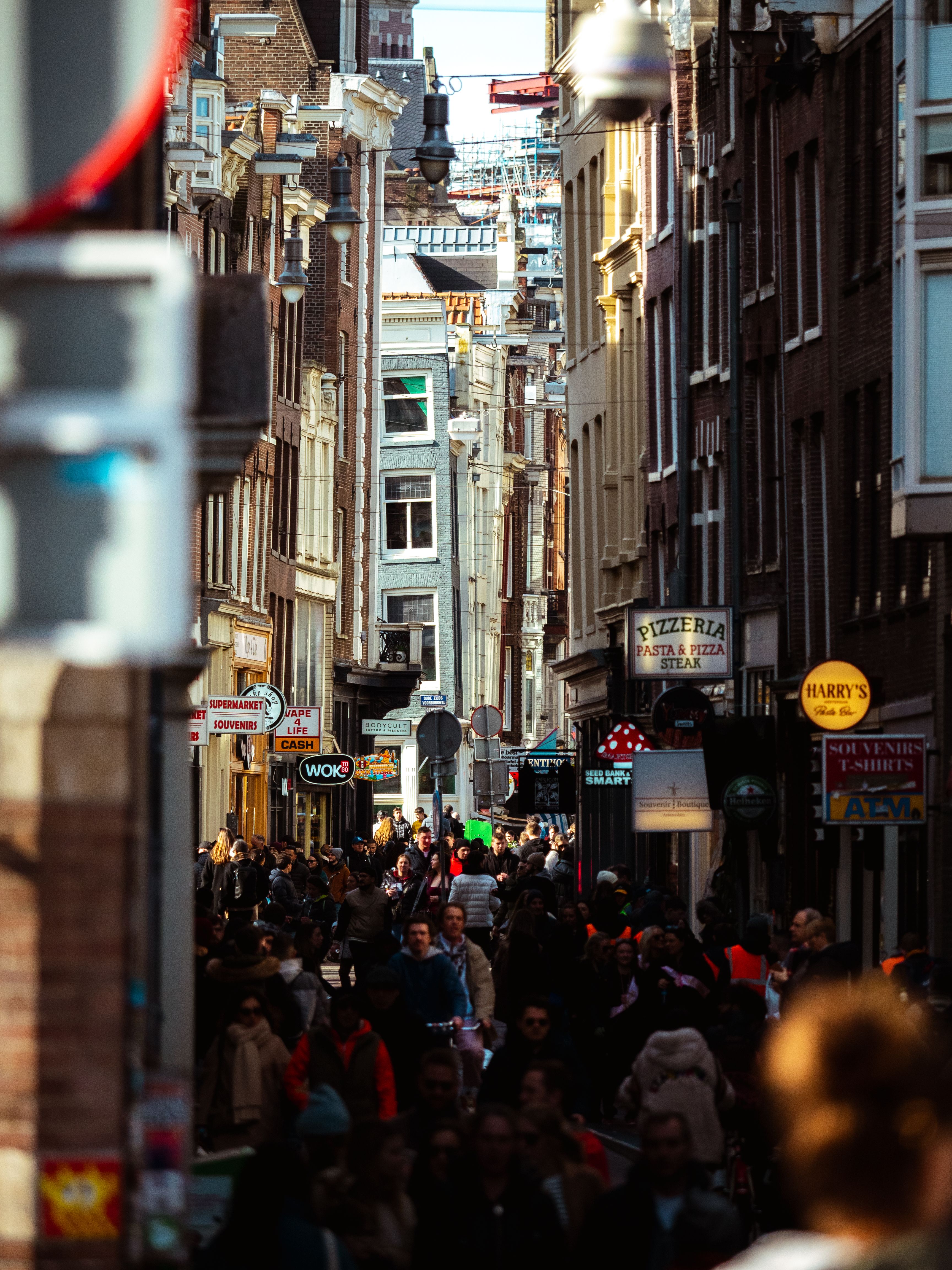 A crowded city street with people walking down it · Free Stock Photo