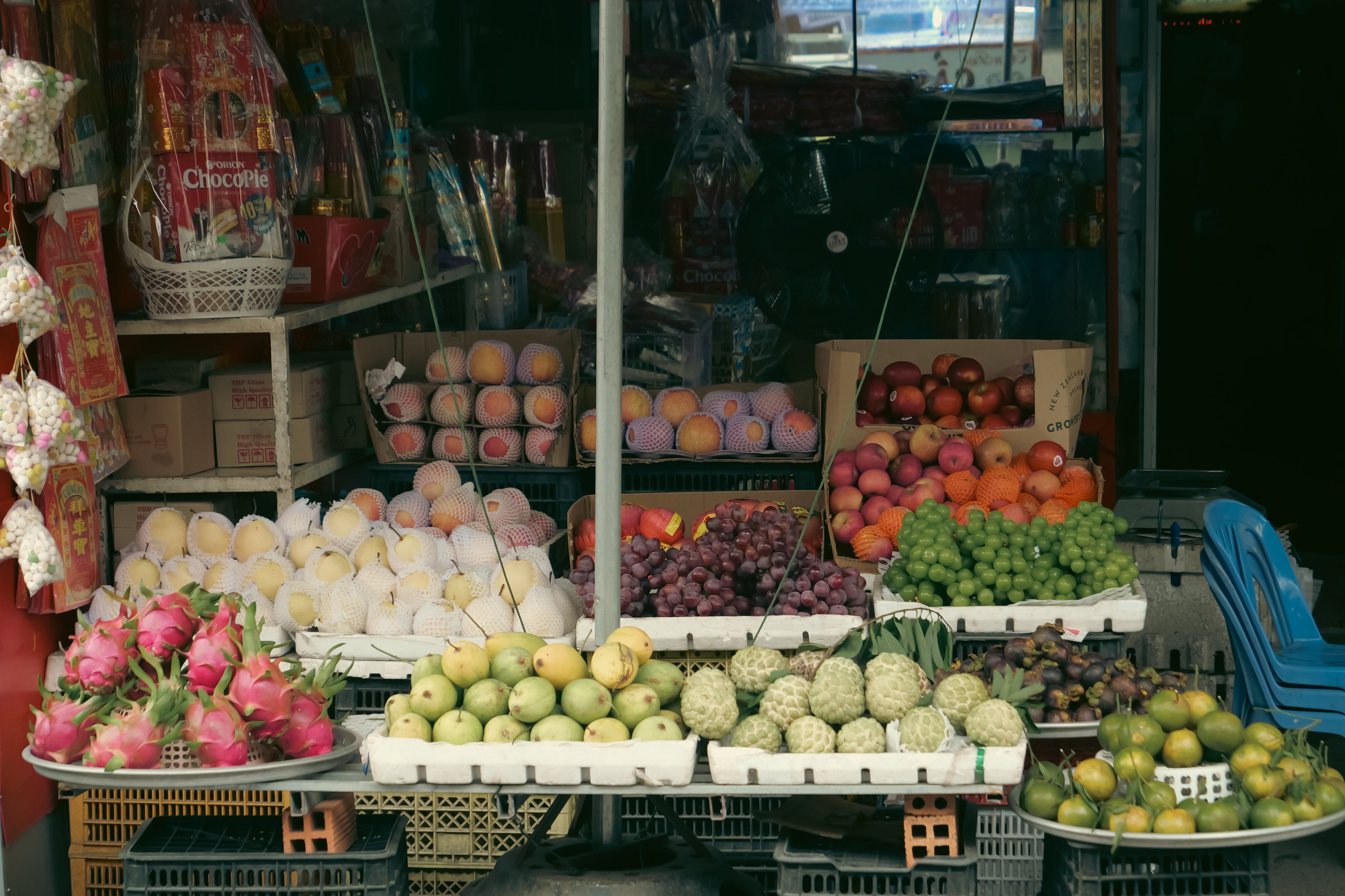 A fruit stand with many different fruits and vegetables · Free Stock Photo