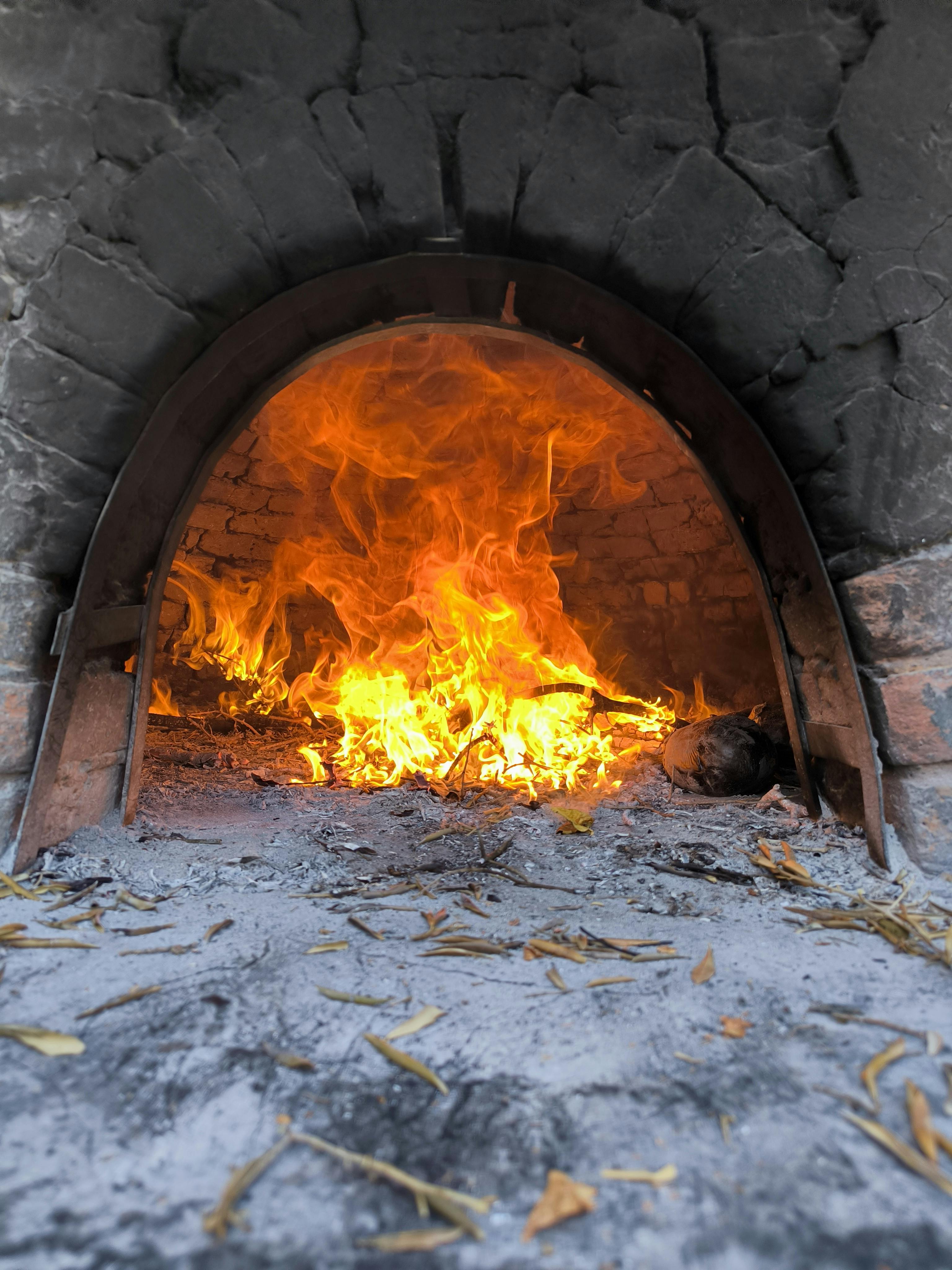 A fire is burning in an oven · Free Stock Photo