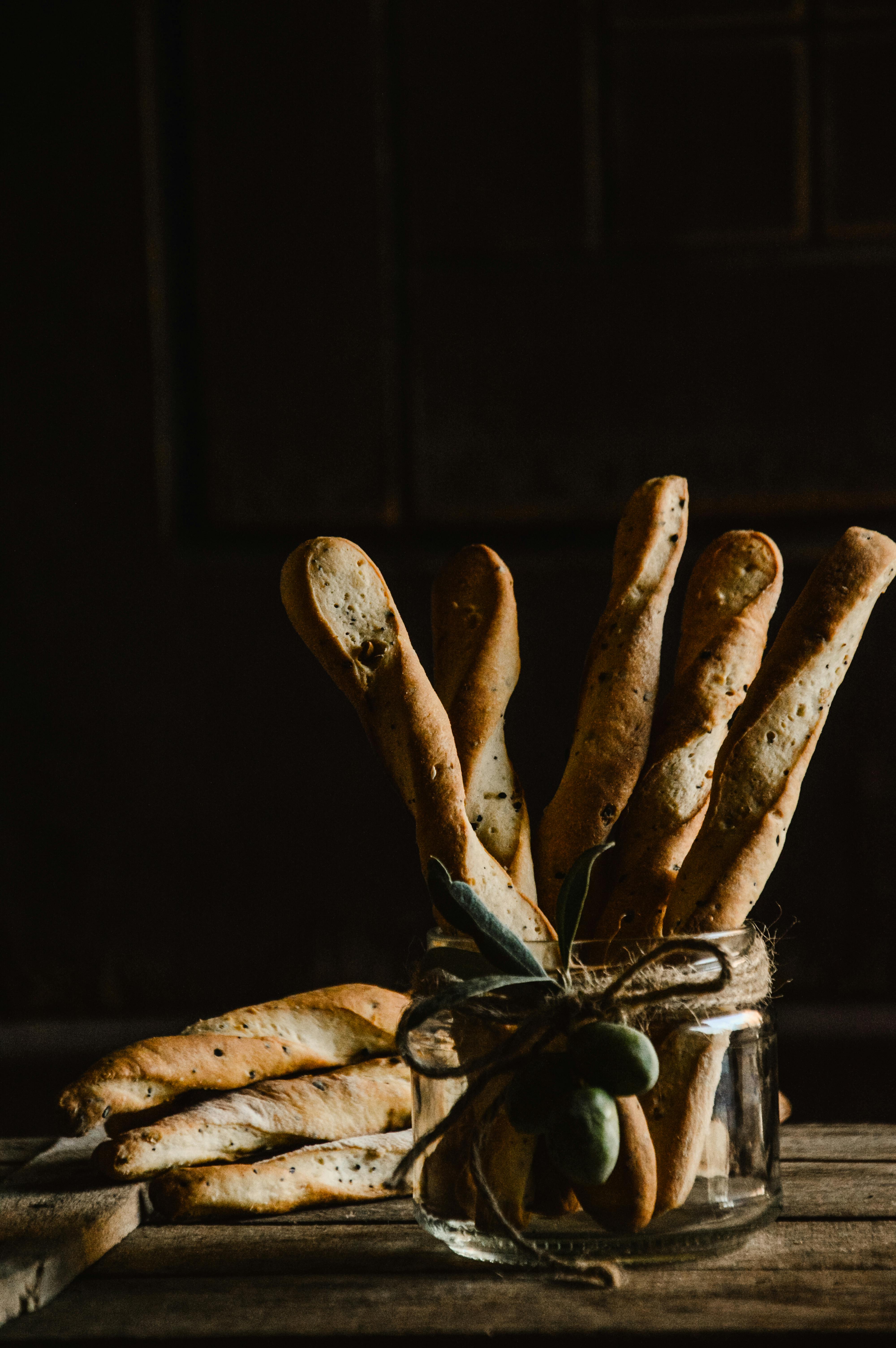 Breadsticks in a jar with olive oil · Free Stock Photo