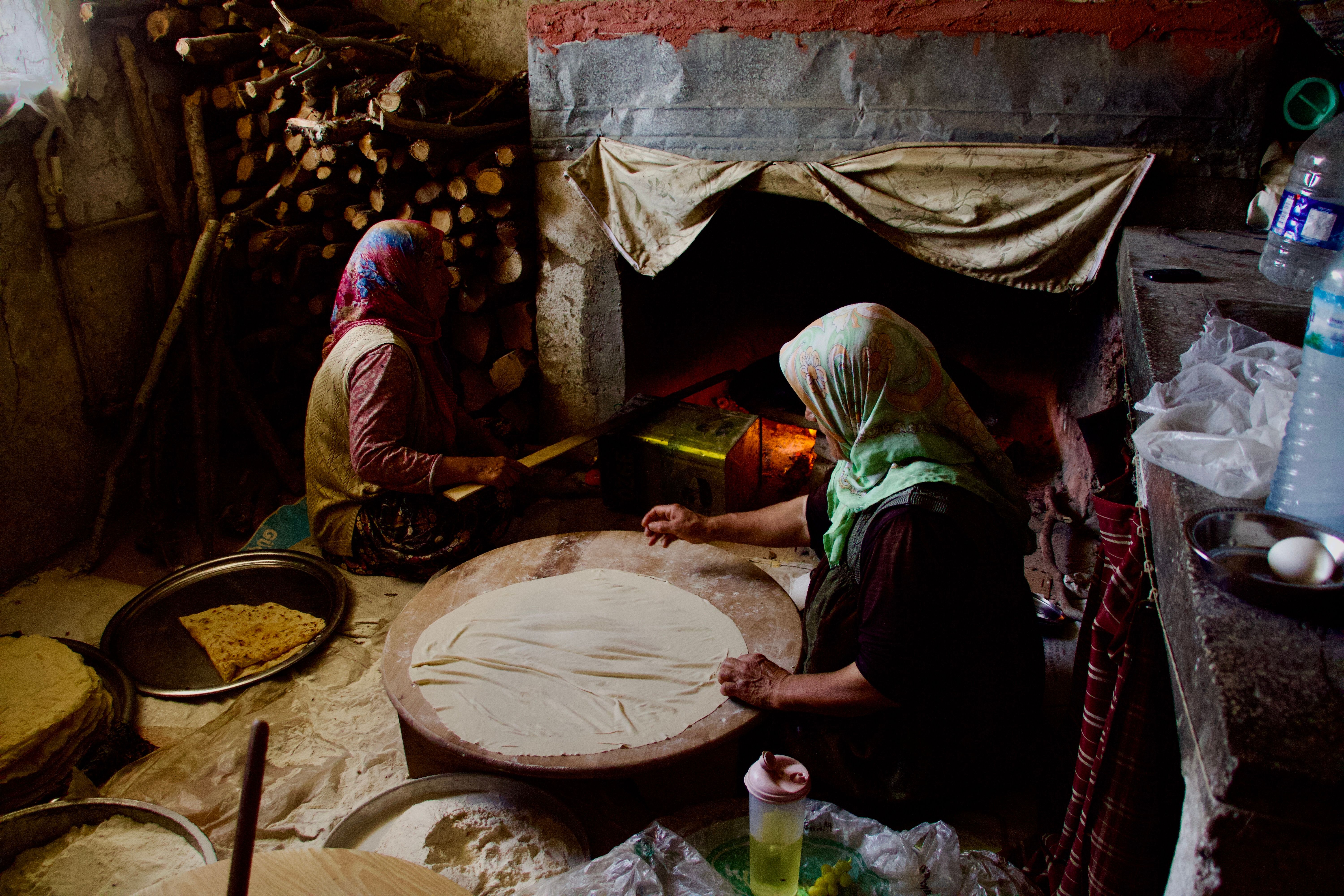 Two women are making bread in a kitchen · Free Stock Photo