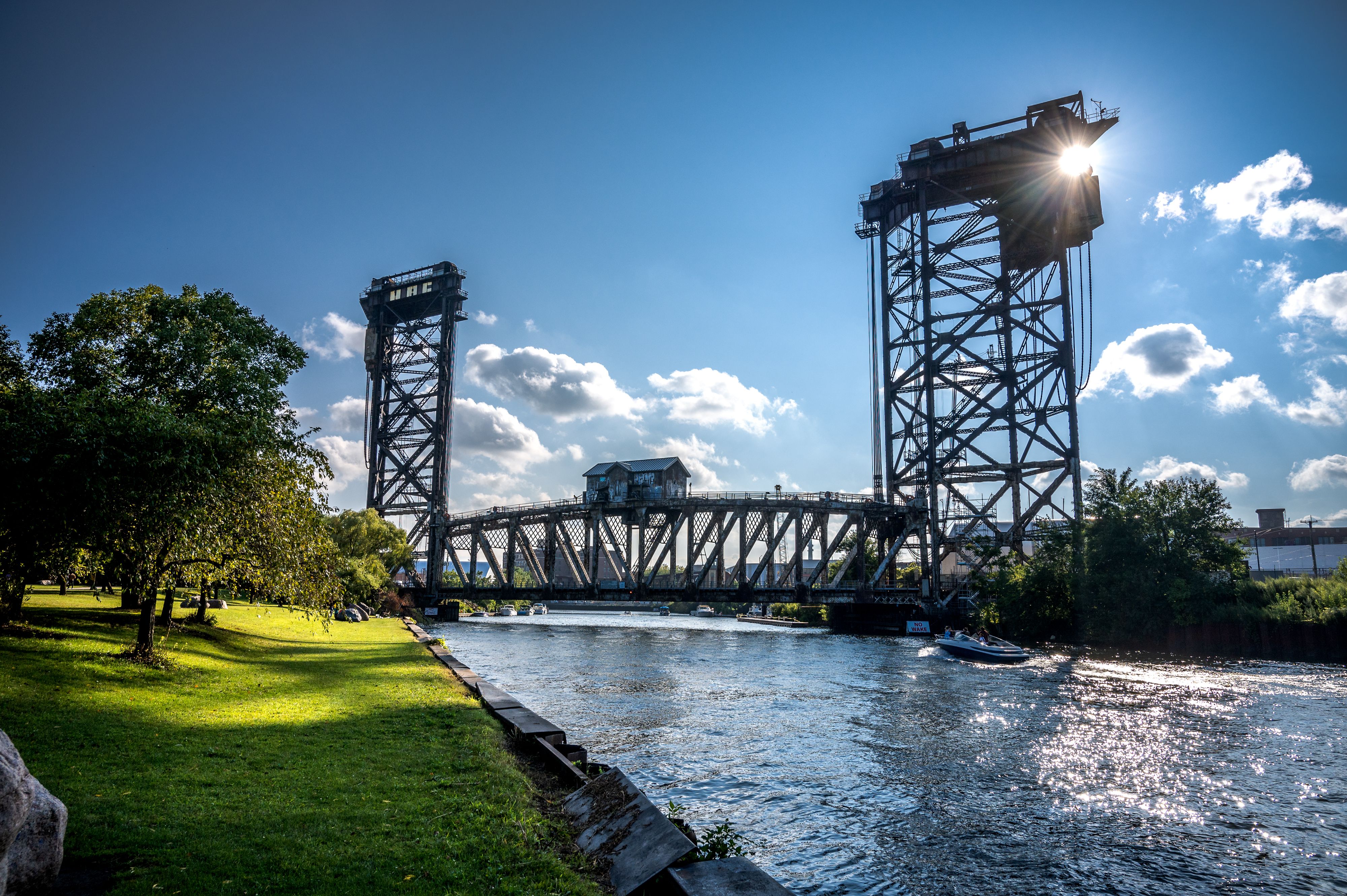 A train bridge over a river with a train in the background · Free Stock ...