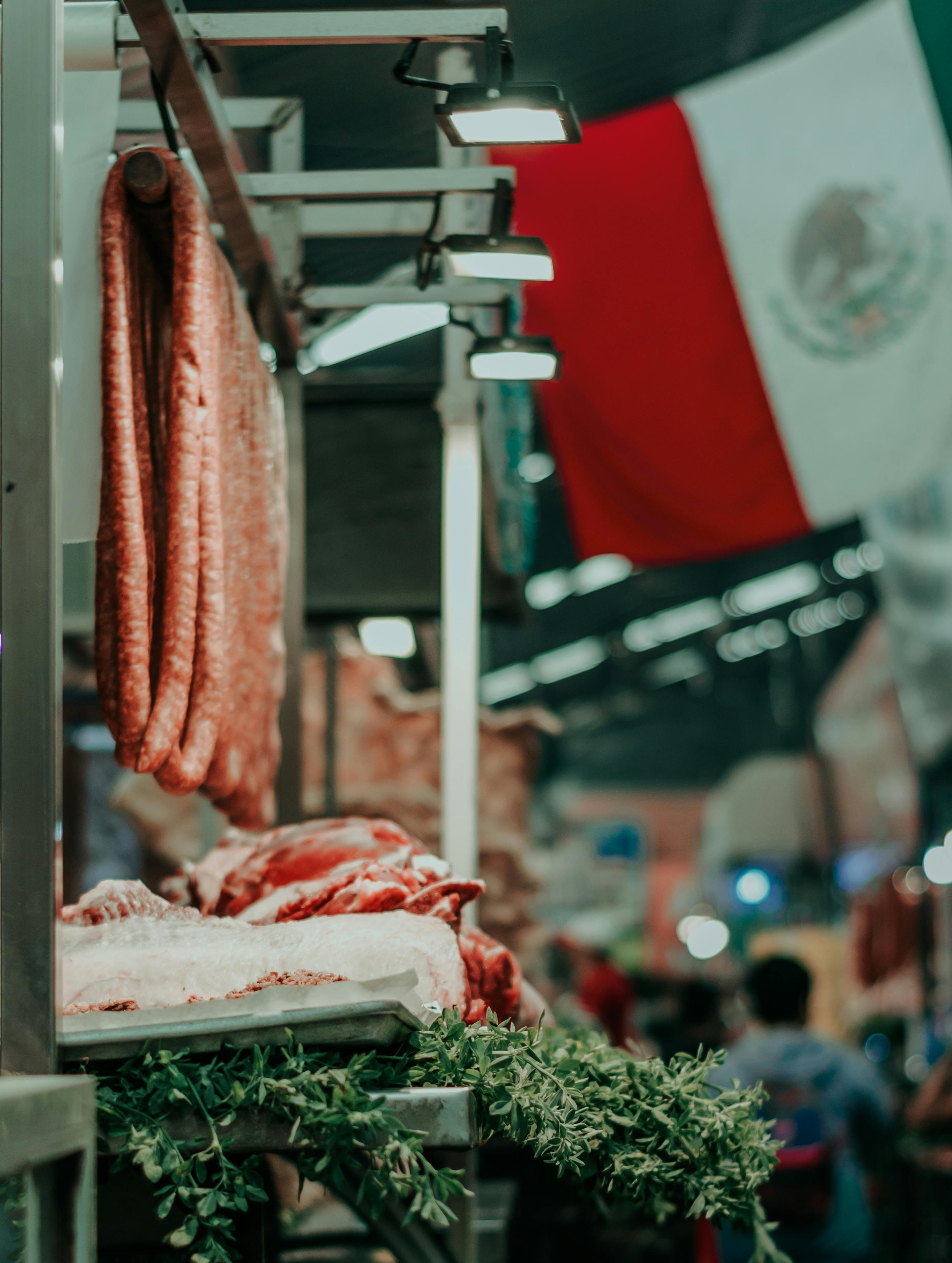 A meat market with mexican flags hanging from the ceiling · Free Stock ...