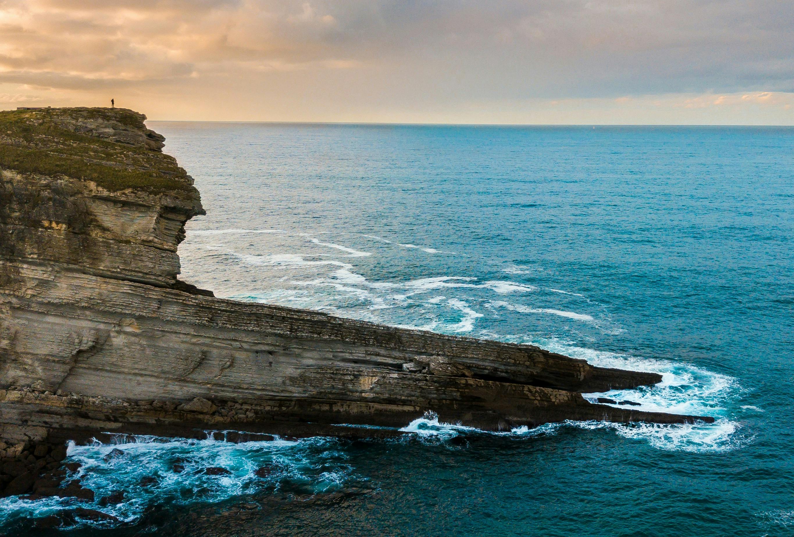 Rock Formation on Sea during Dawn · Free Stock Photo