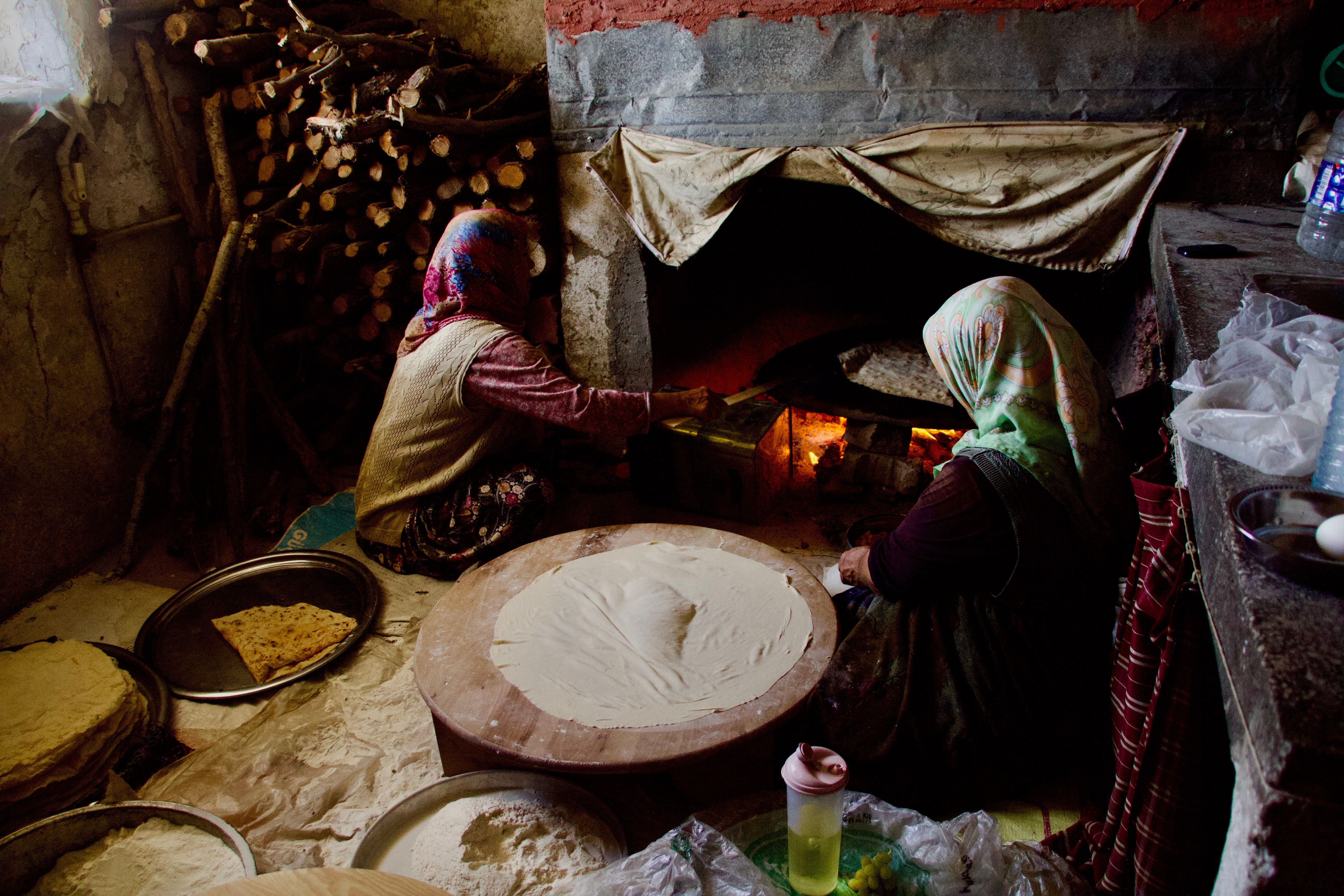 Two women are making bread in a kitchen · Free Stock Photo