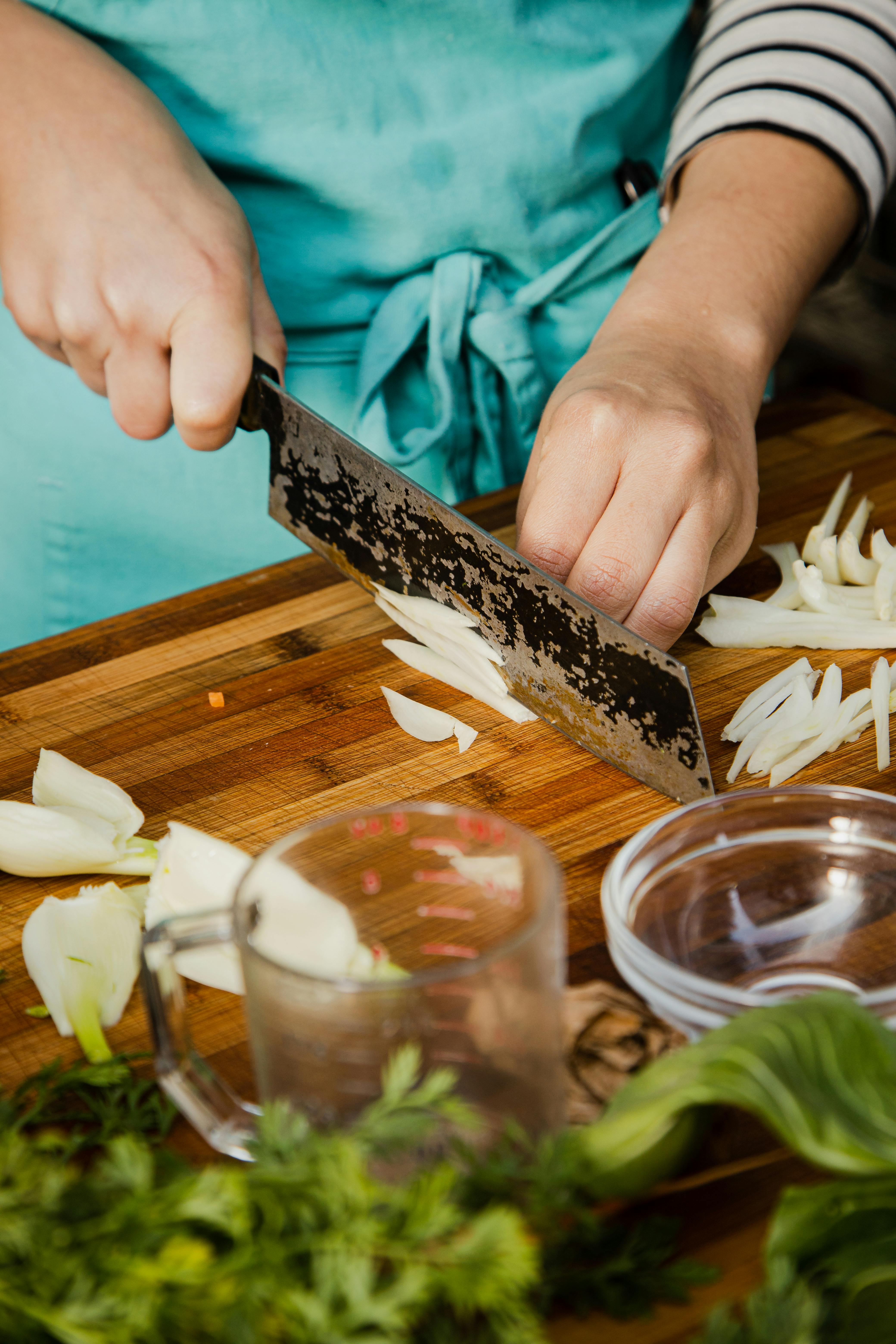 Chef Preparing Vegetable Dish on Tree Slab · Free Stock Photo