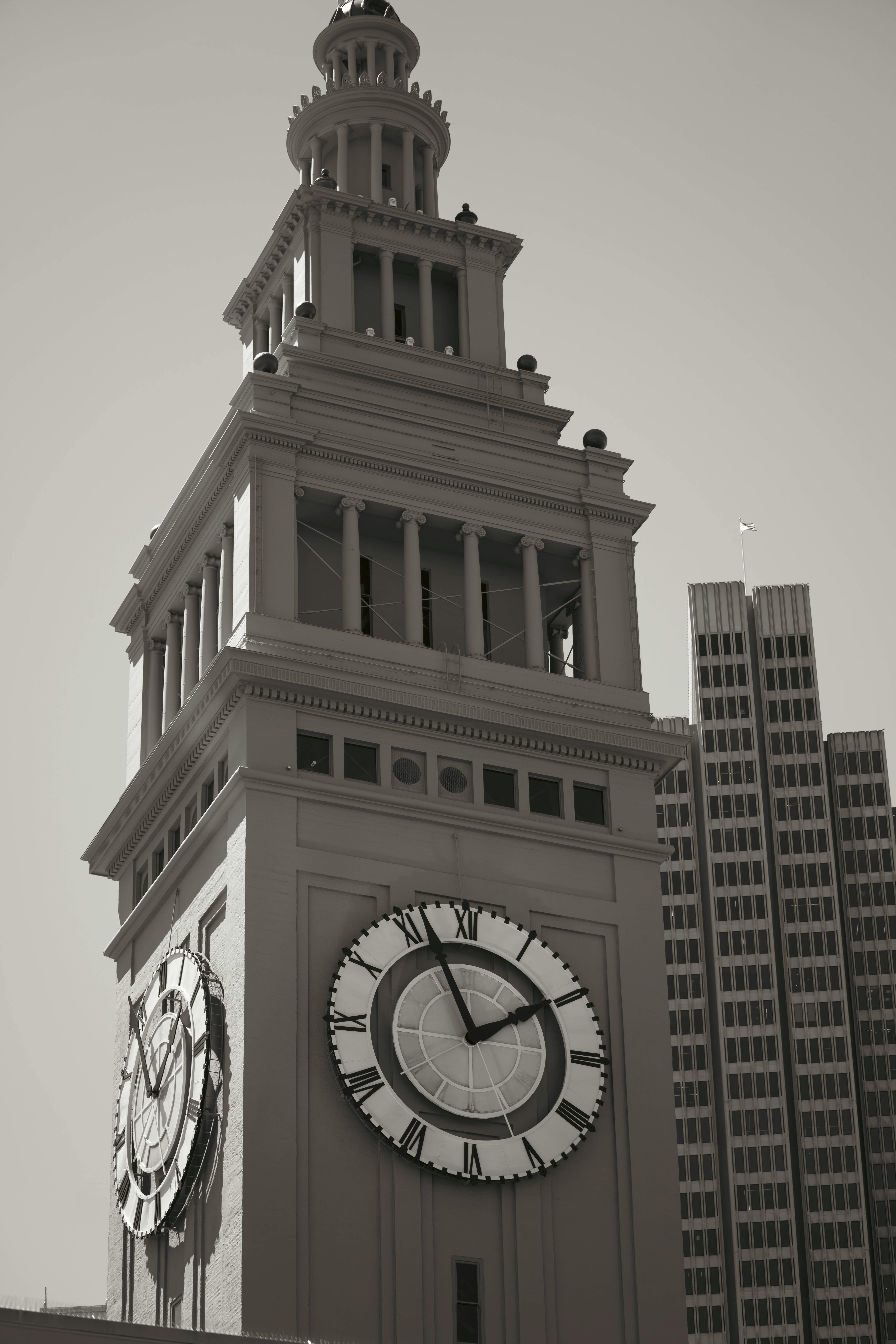 Close-up Photo of Street Clock Near Tall Building · Free Stock Photo