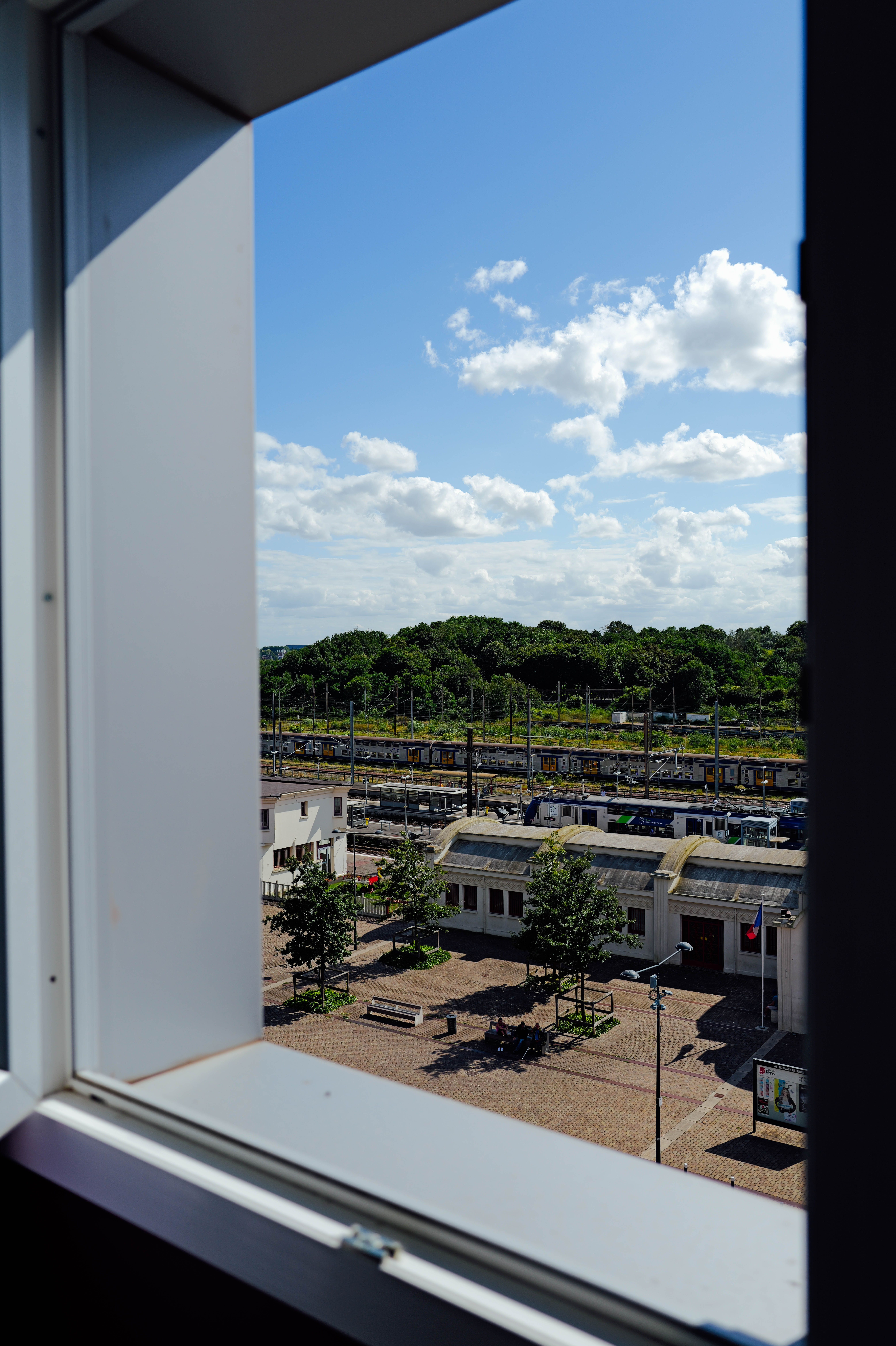 A view of a train station through a window · Free Stock Photo